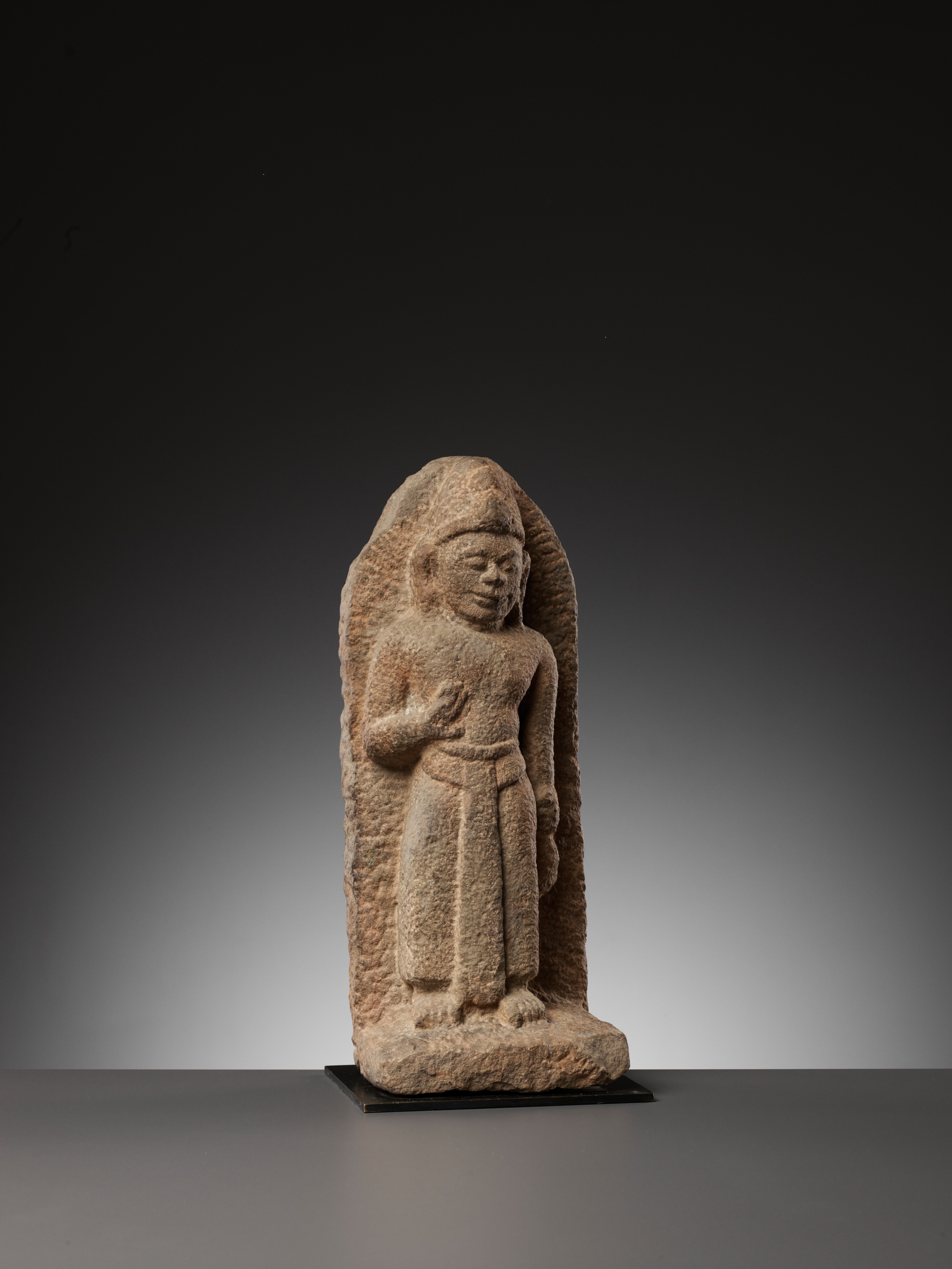 Lot 1180 - A SANDSTONE FIGURE OF A MALE DEITY, CHAM
