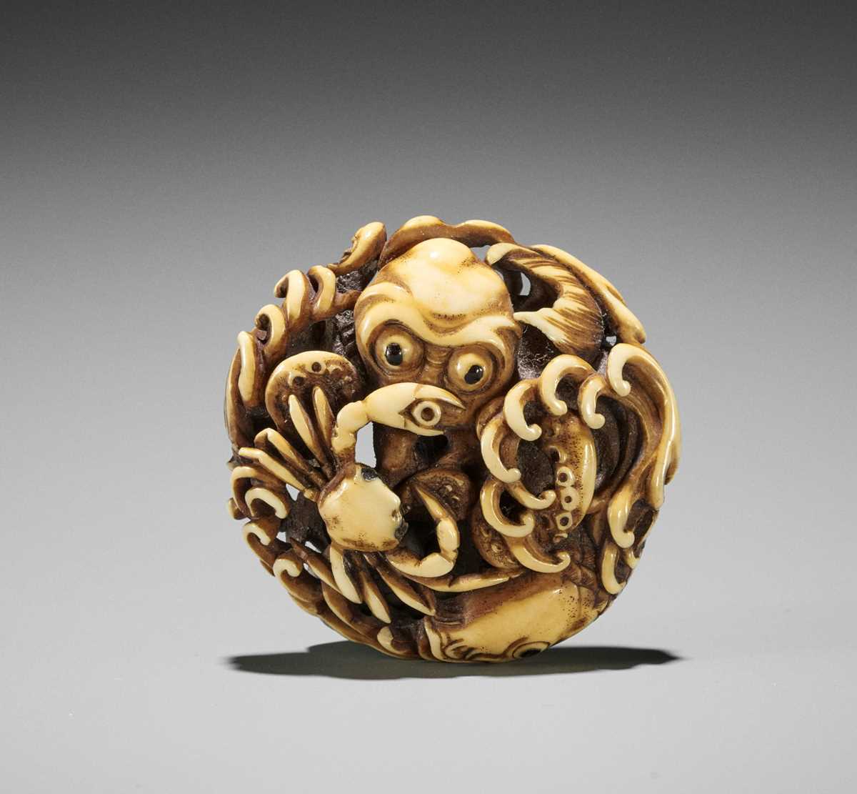 Lot 1532 - A WALRUS TUSK RYUSA MANJU NETSUKE WITH