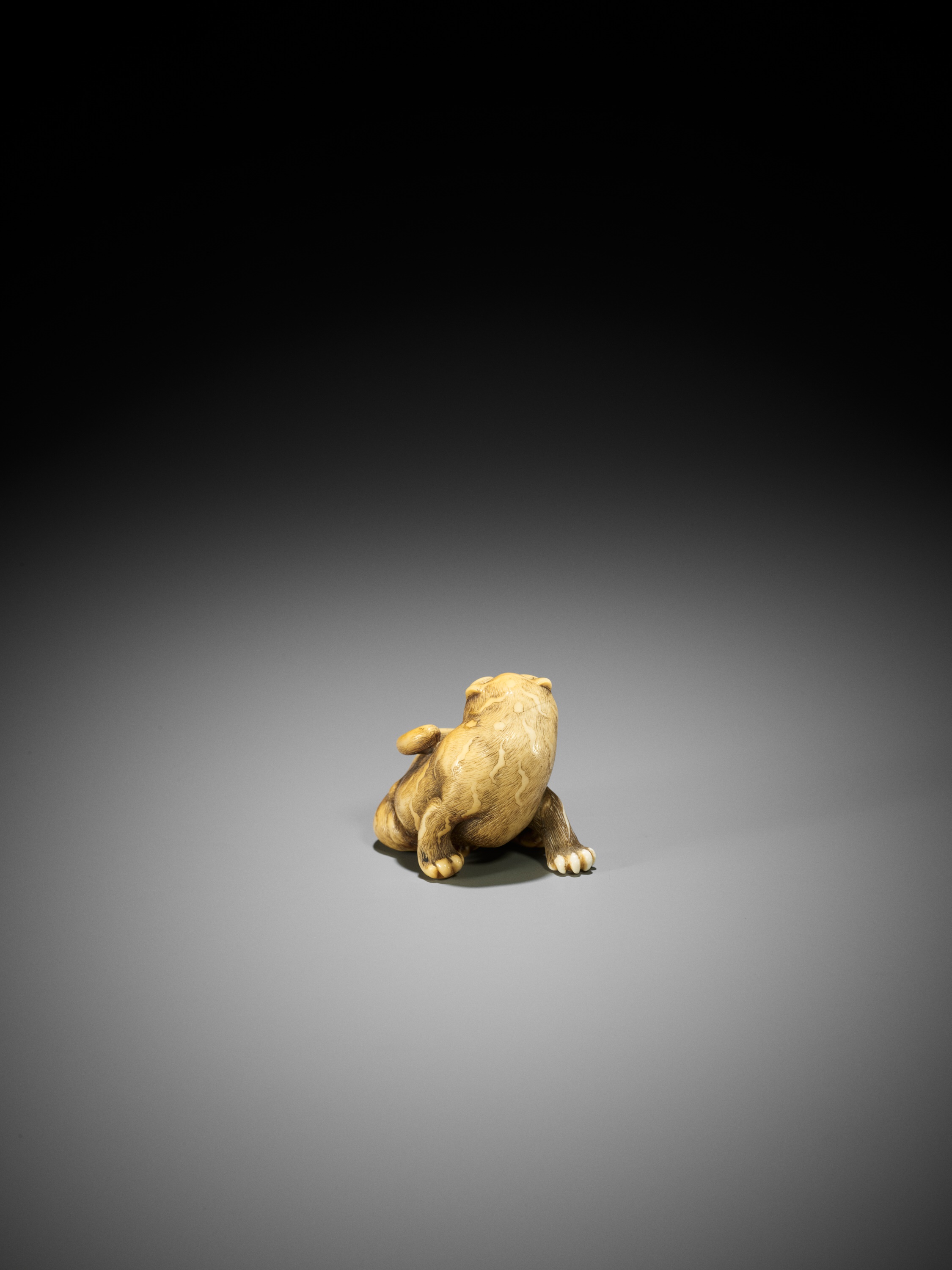 Lot 69 - A SUPERB OSAKA SCHOOL IVORY NETSUKE OF A