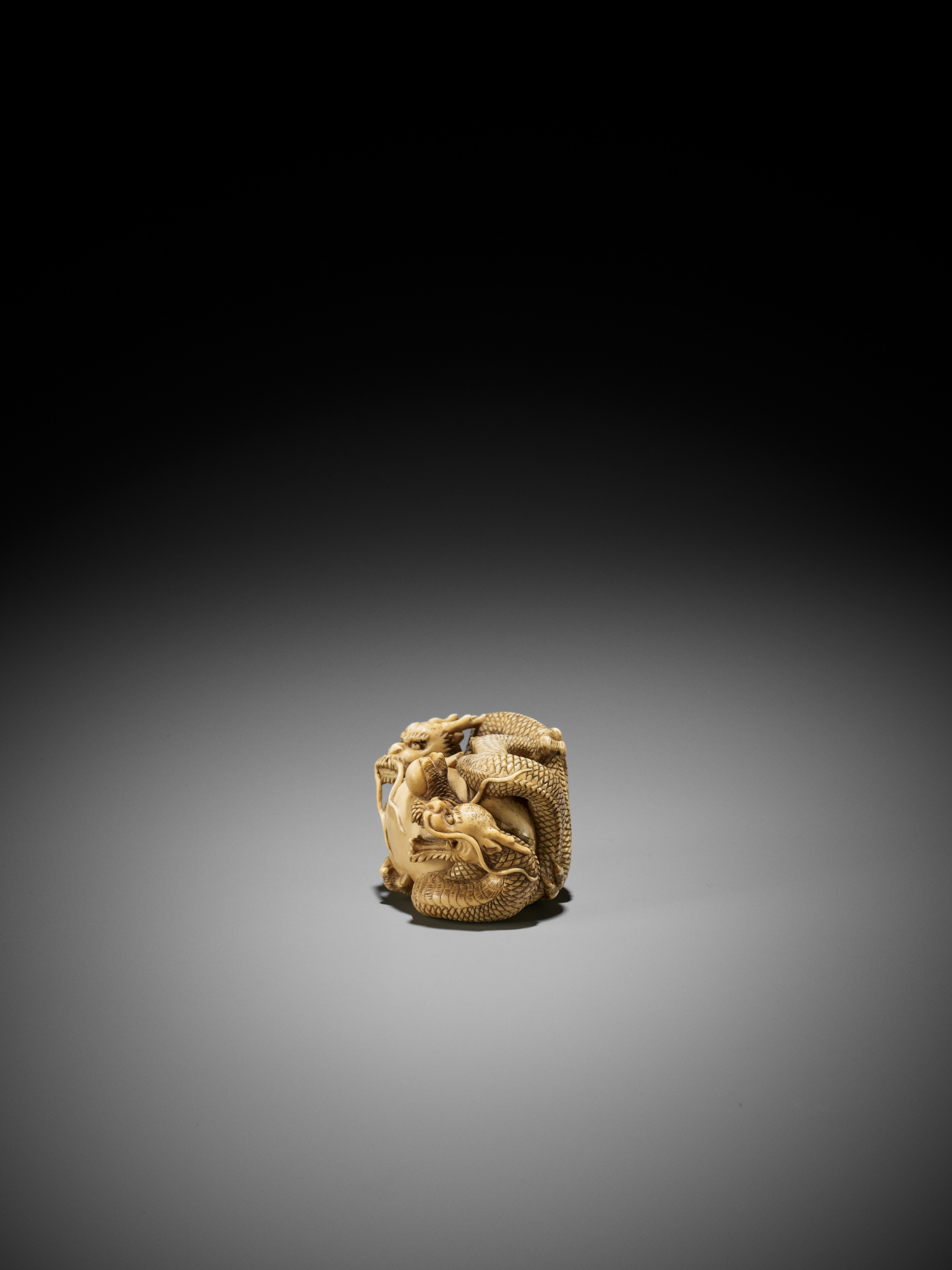 Lot 66 - SADAHIRO: A RARE IVORY NETSUKE OF TWO