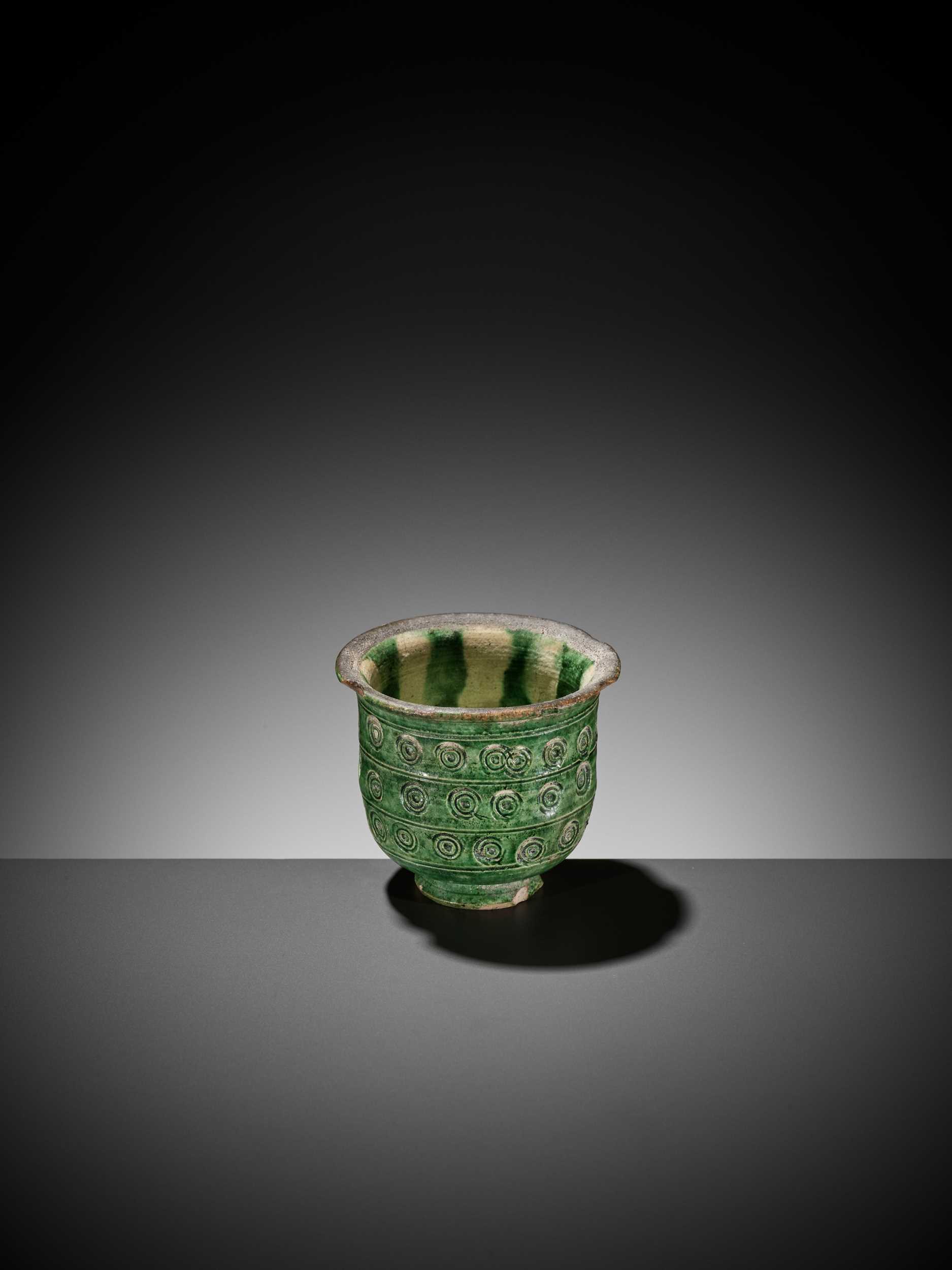 Lot 53 - A RARE GREEN-GLAZED BELL-SHAPED CUP, TANG