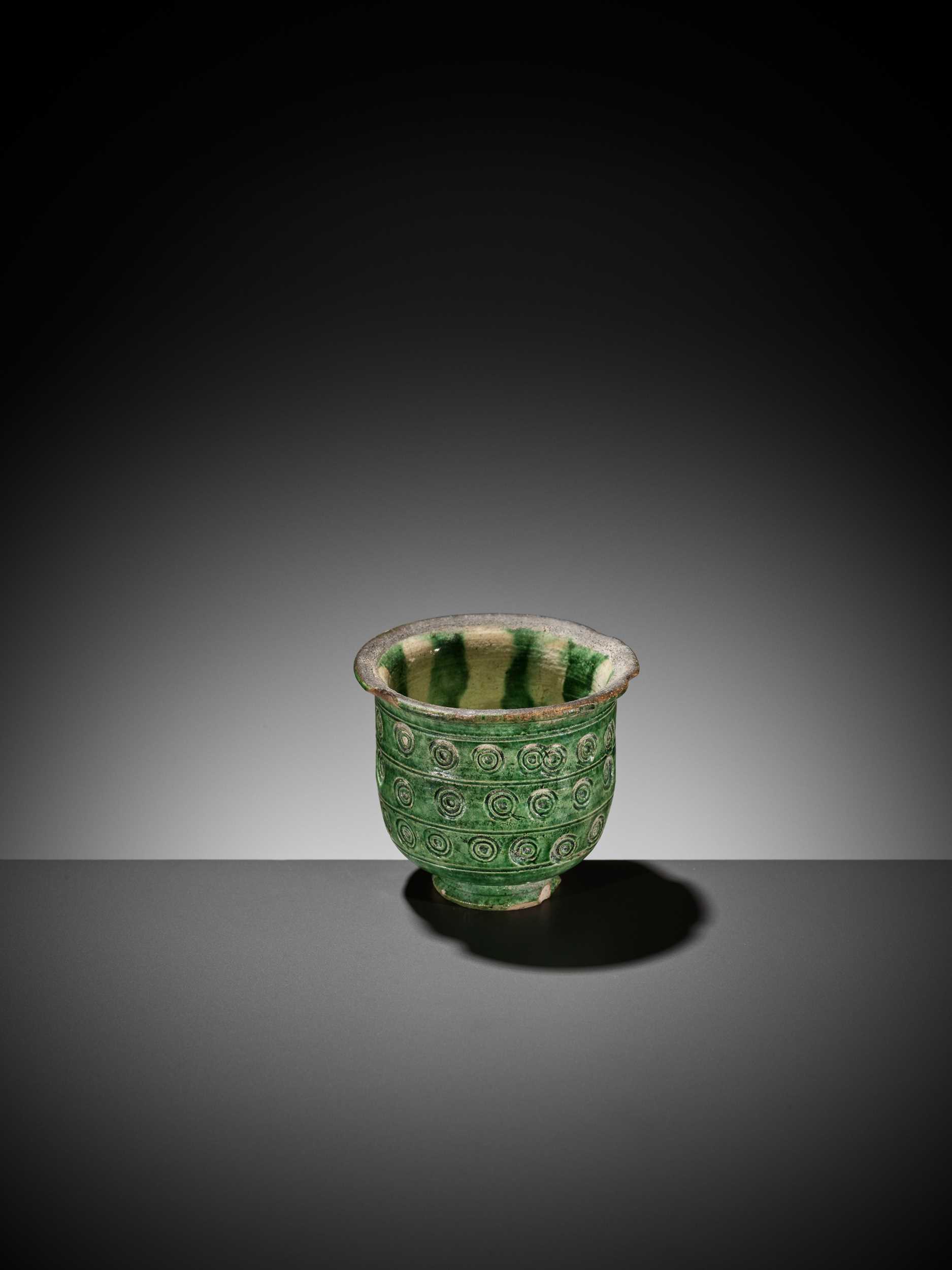 Lot 53 - A RARE GREEN-GLAZED BELL-SHAPED CUP, TANG