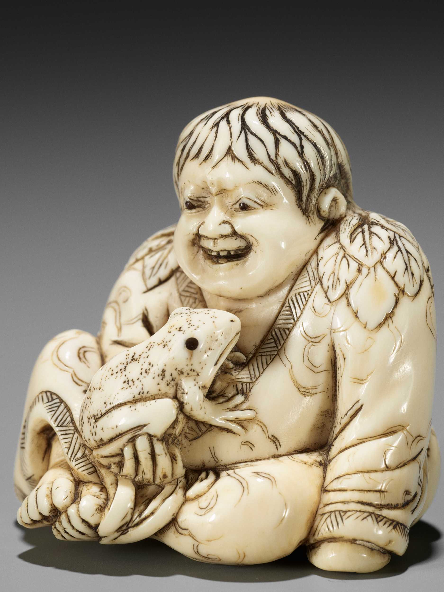 Lot 2 - TOMOTADA: A RARE AND IMPORTANT IVORY NETSUKE