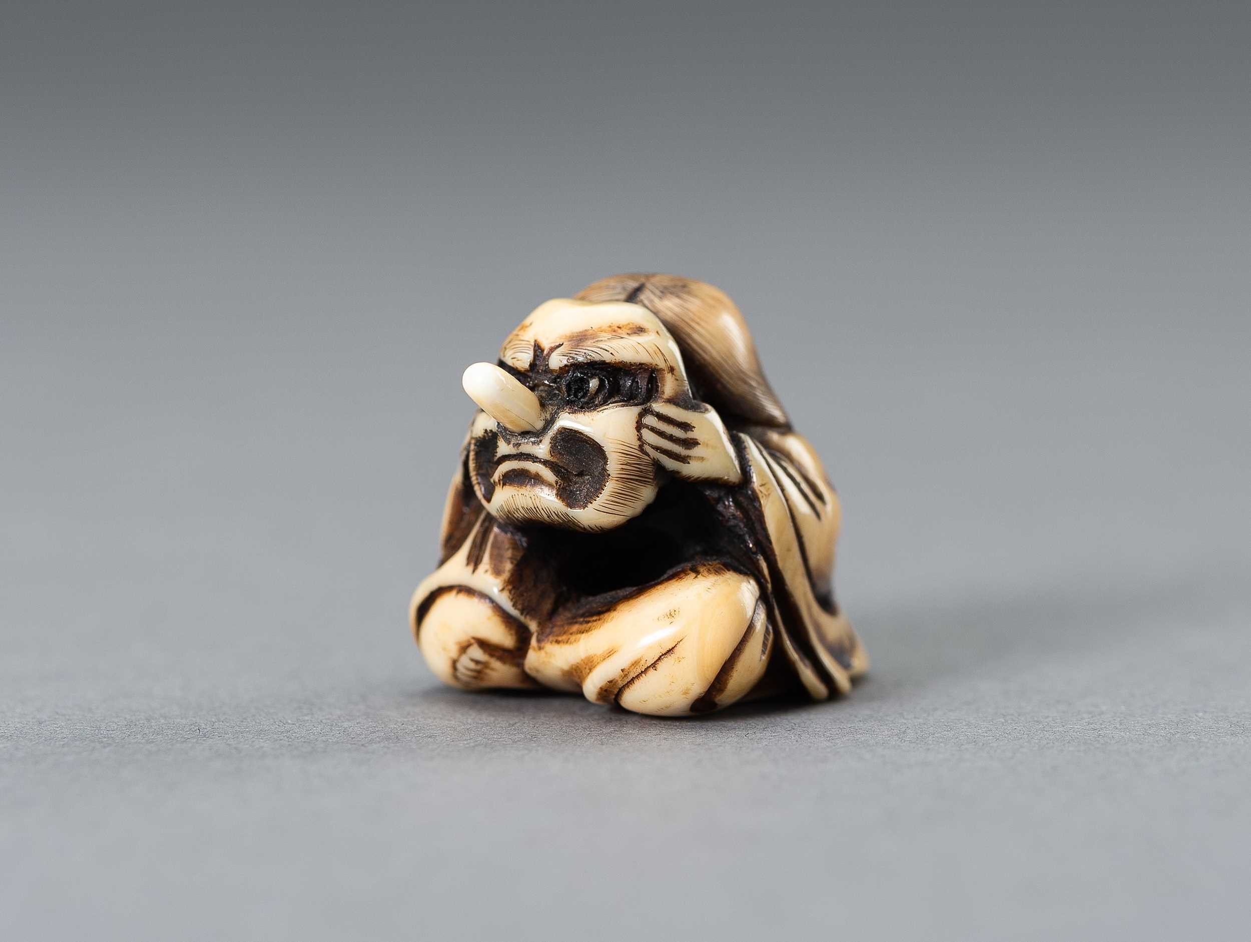 Lot 483 - MASAMITSU: A MARINE IVORY NETSUKE OF OKAME