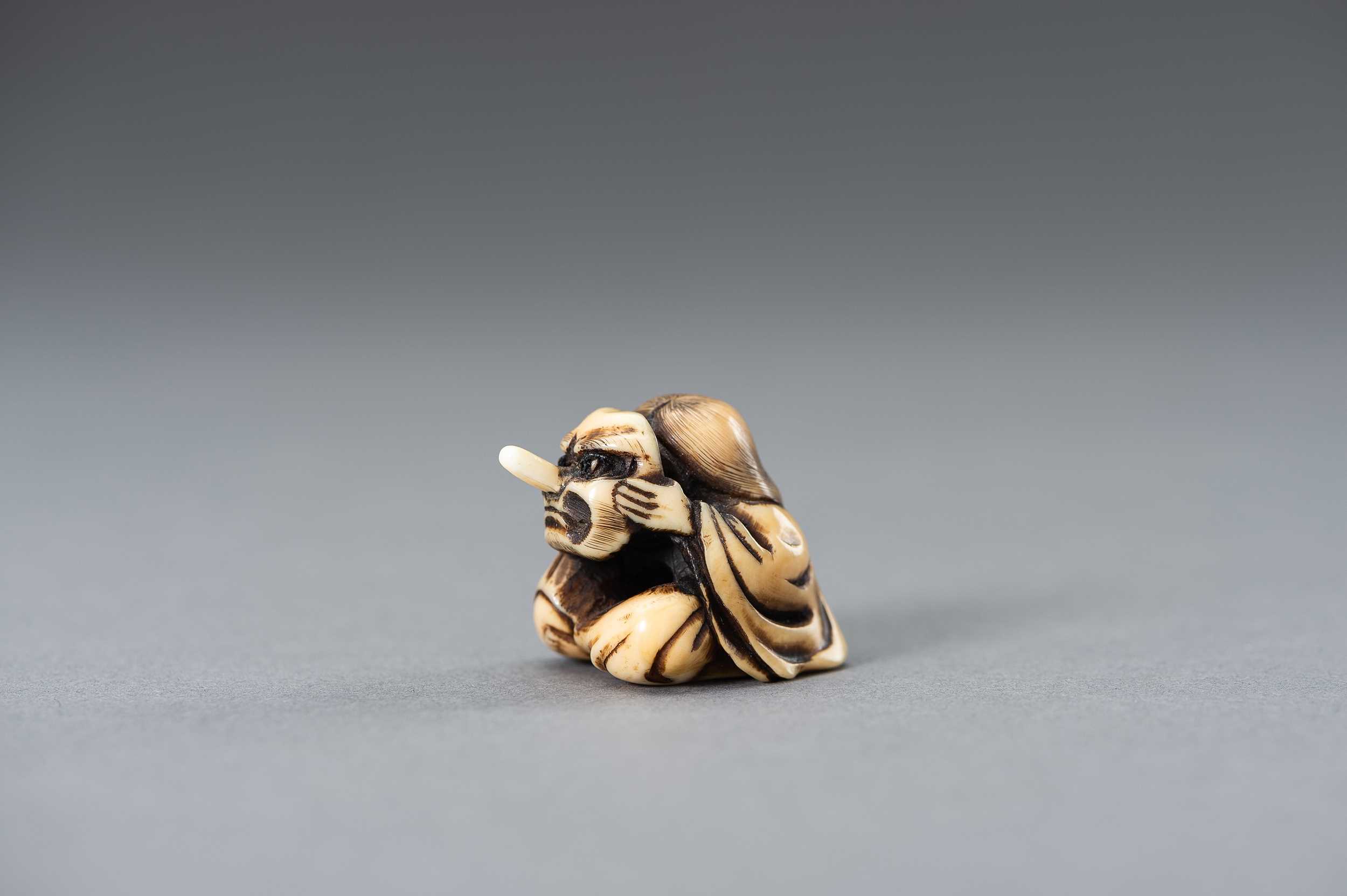 Lot 483 - MASAMITSU: A MARINE IVORY NETSUKE OF OKAME