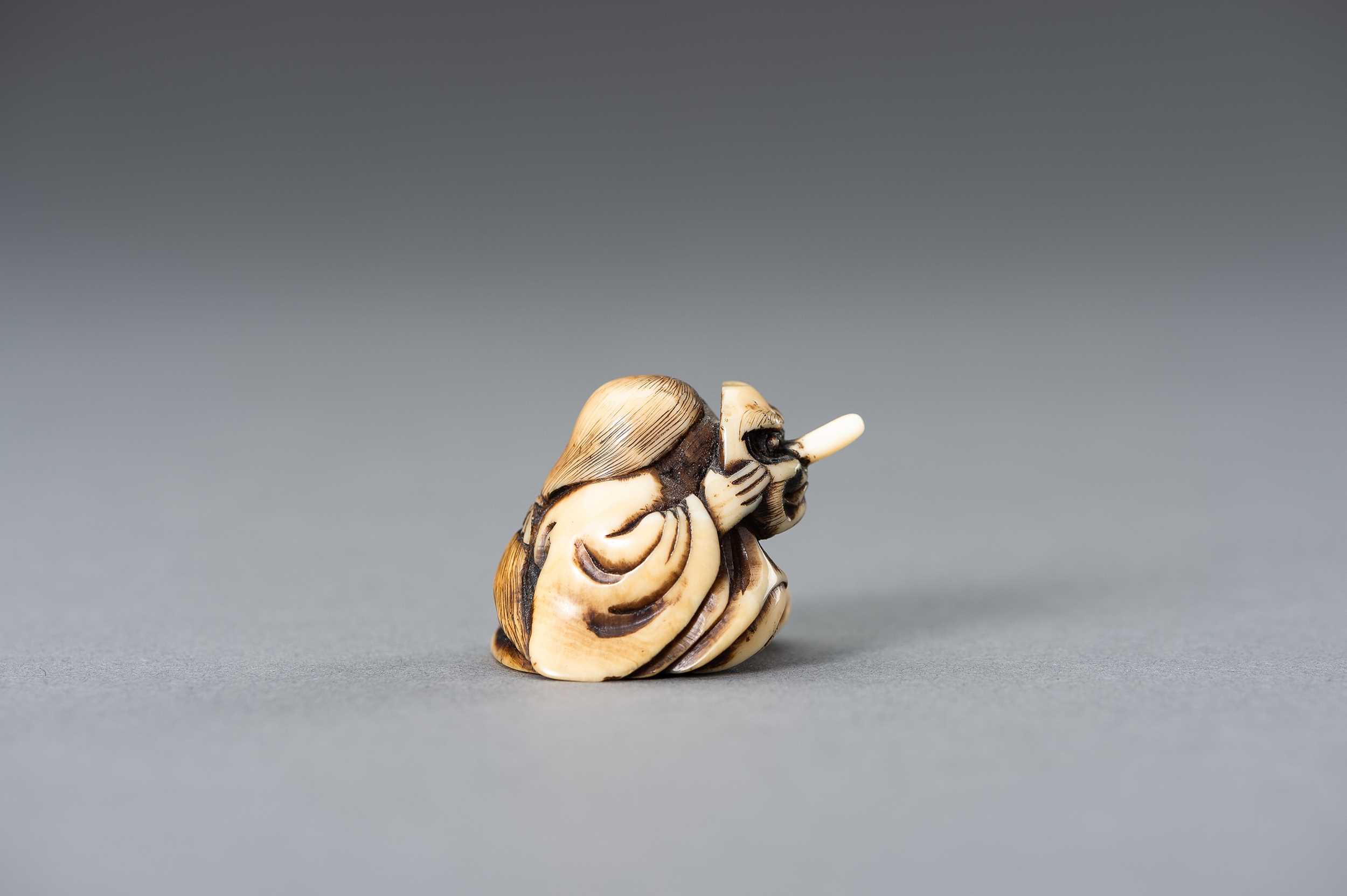 Lot 483 - MASAMITSU: A MARINE IVORY NETSUKE OF OKAME