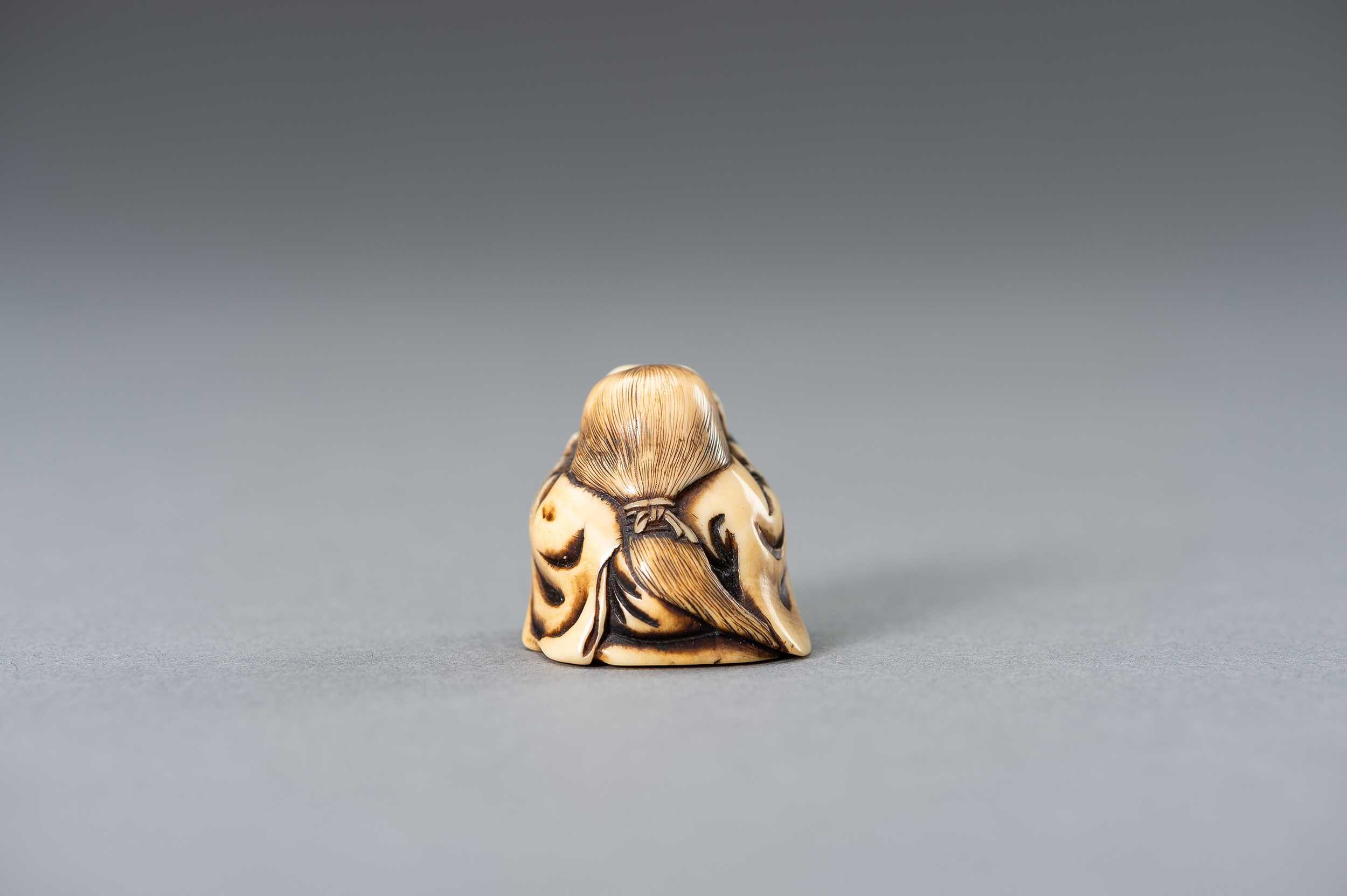 Lot 483 - MASAMITSU: A MARINE IVORY NETSUKE OF OKAME