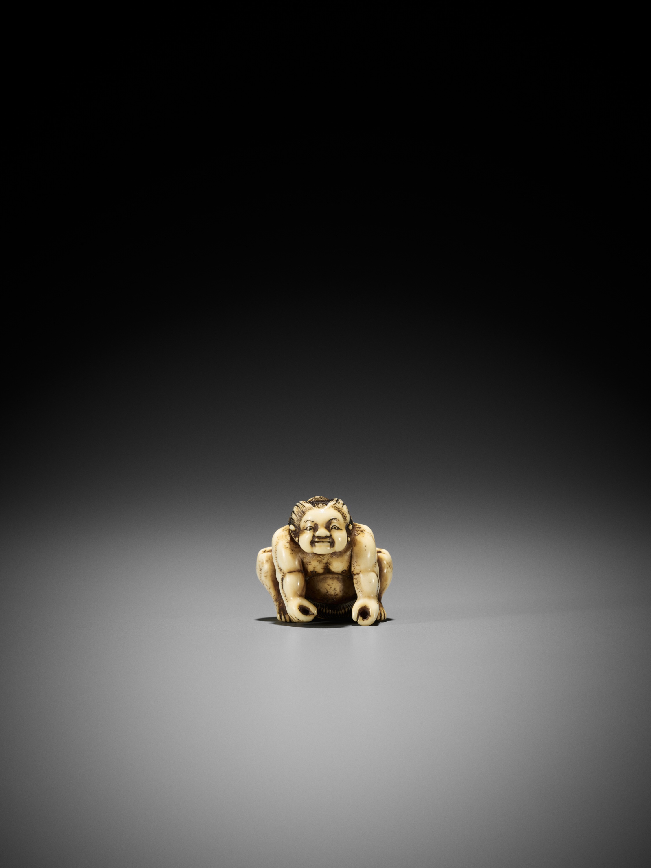 Lot 245 - A RARE IVORY NETSUKE OF A SUMO WRESTLER