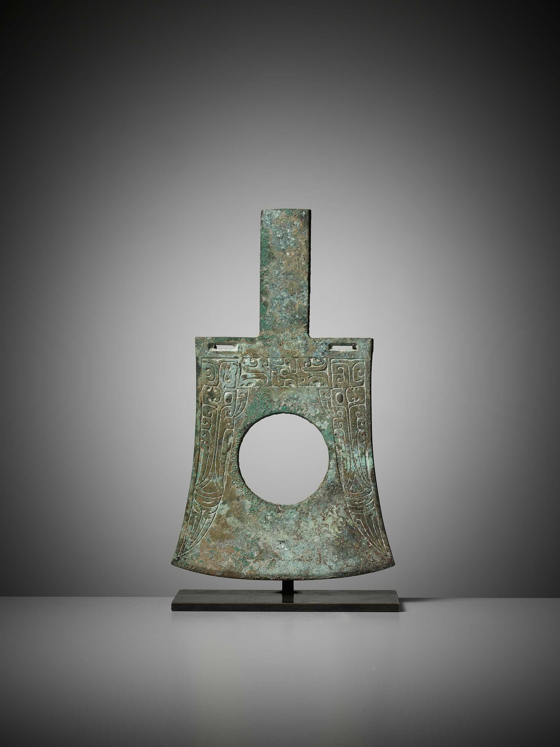 Lot 1 - A RARE AND IMPORTANT BRONZE RITUAL AXE-HEAD,