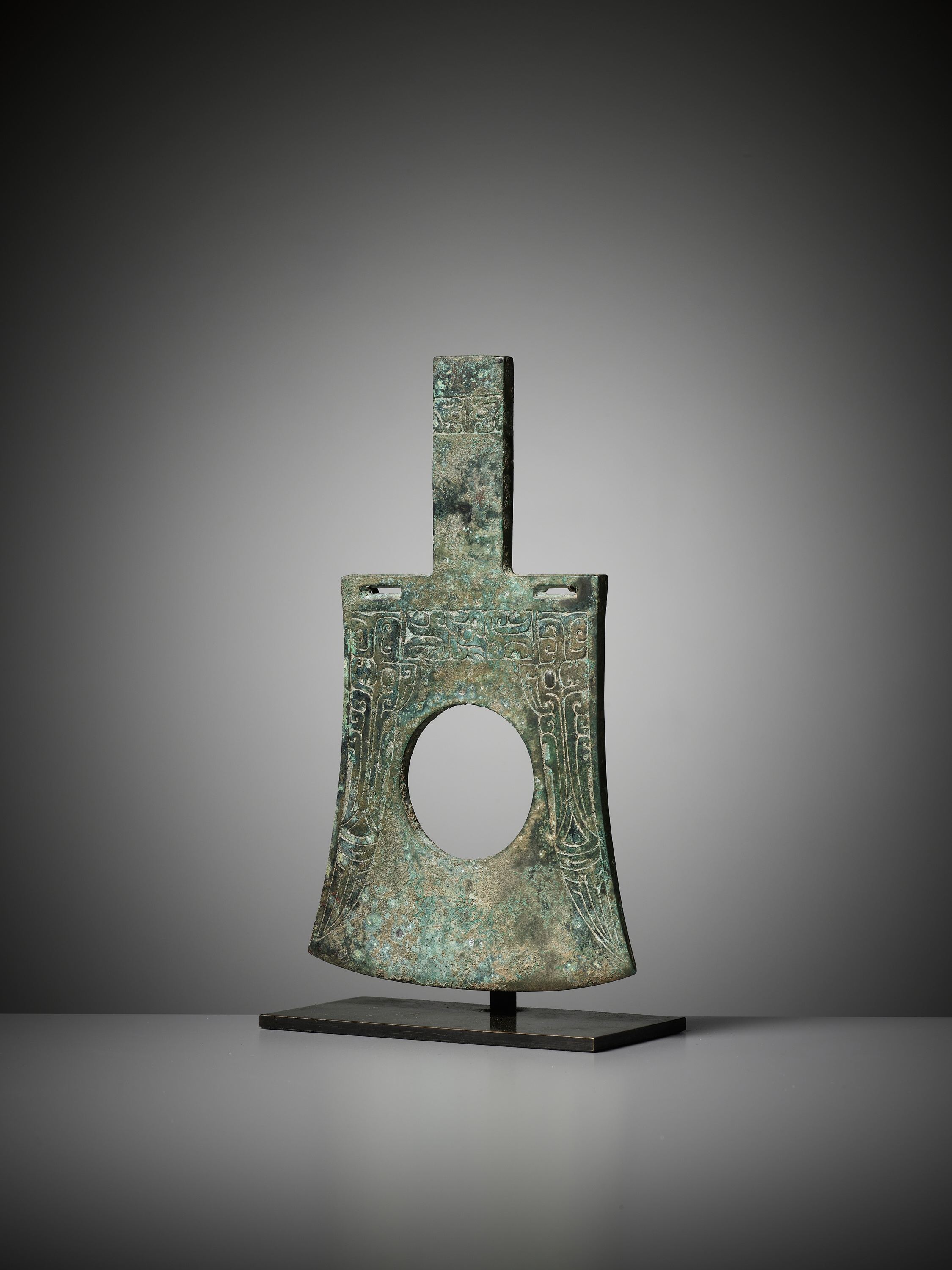 Lot 1 - A RARE AND IMPORTANT BRONZE RITUAL AXE-HEAD,