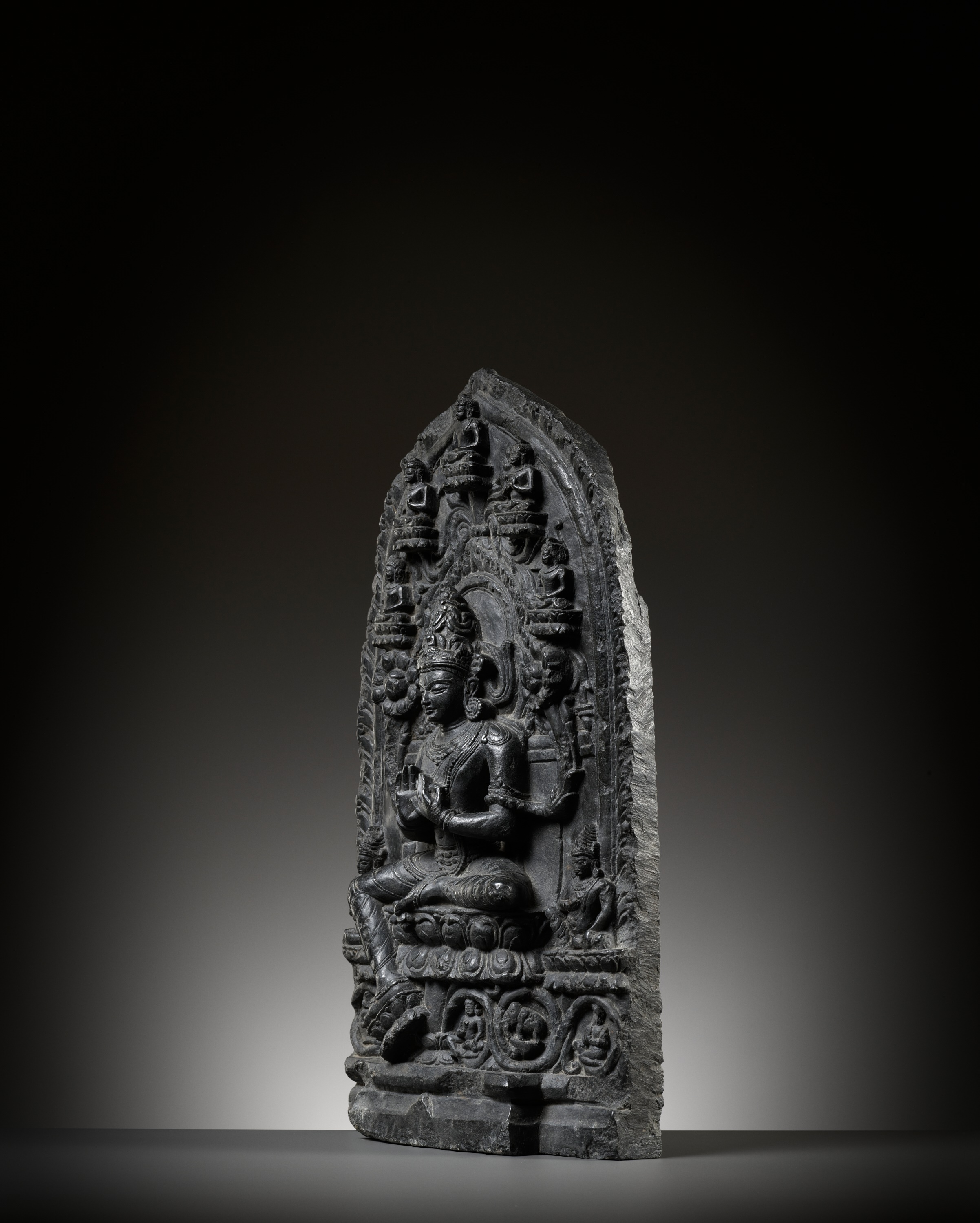 Lot 698 - A BLACK STONE STELE OF AN AVALOKITESHVARA