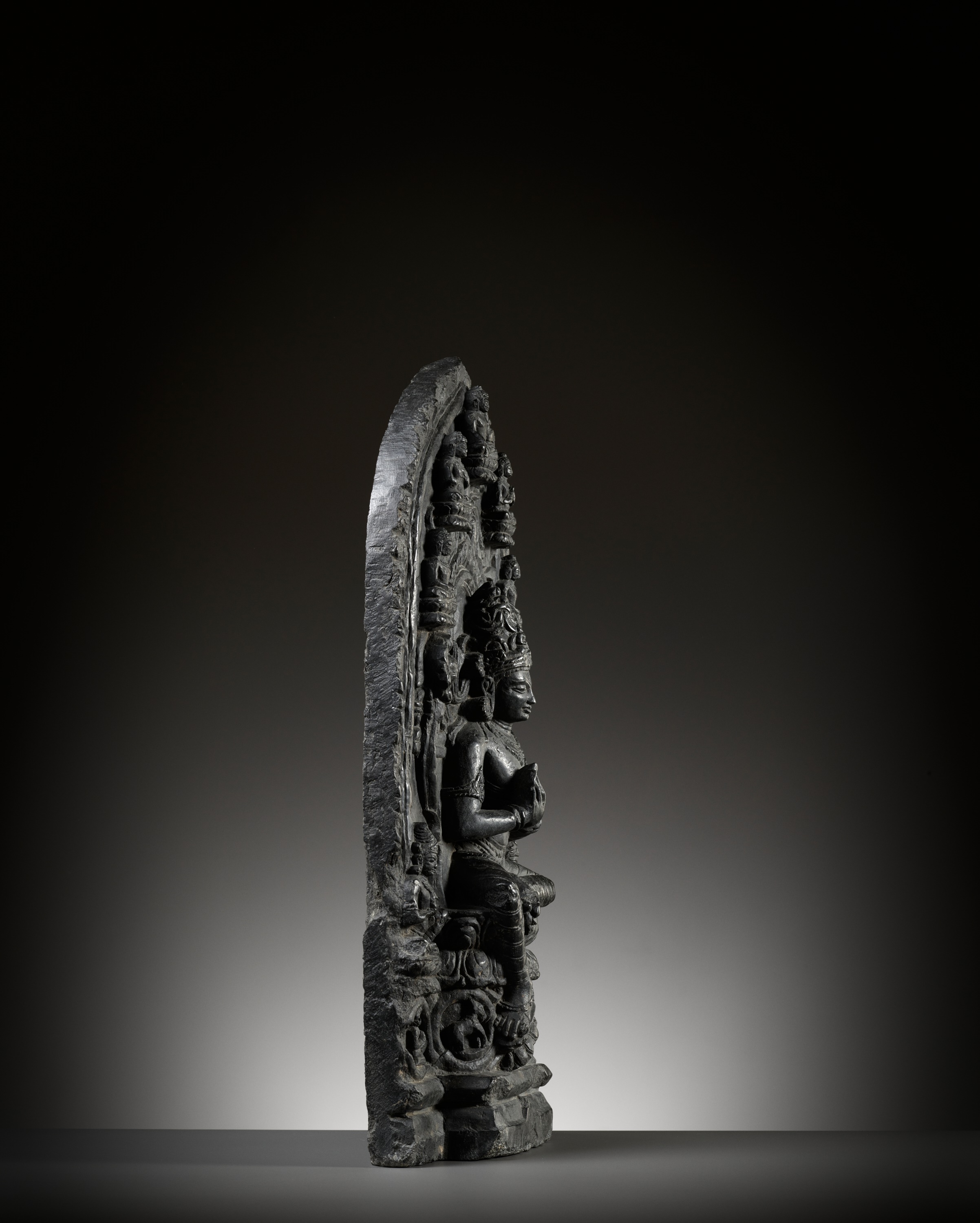 Lot 698 - A BLACK STONE STELE OF AN AVALOKITESHVARA