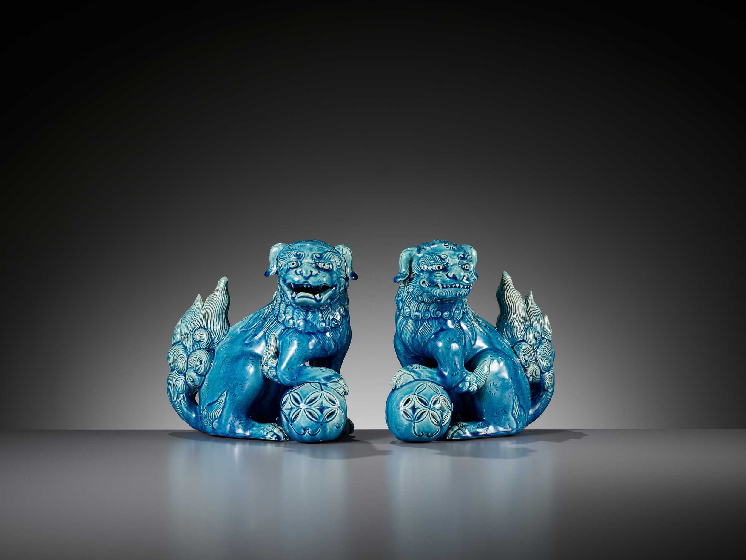 Lot 433 - A PAIR OF TURQUOISE GLAZED BUDDHIST LIONS,