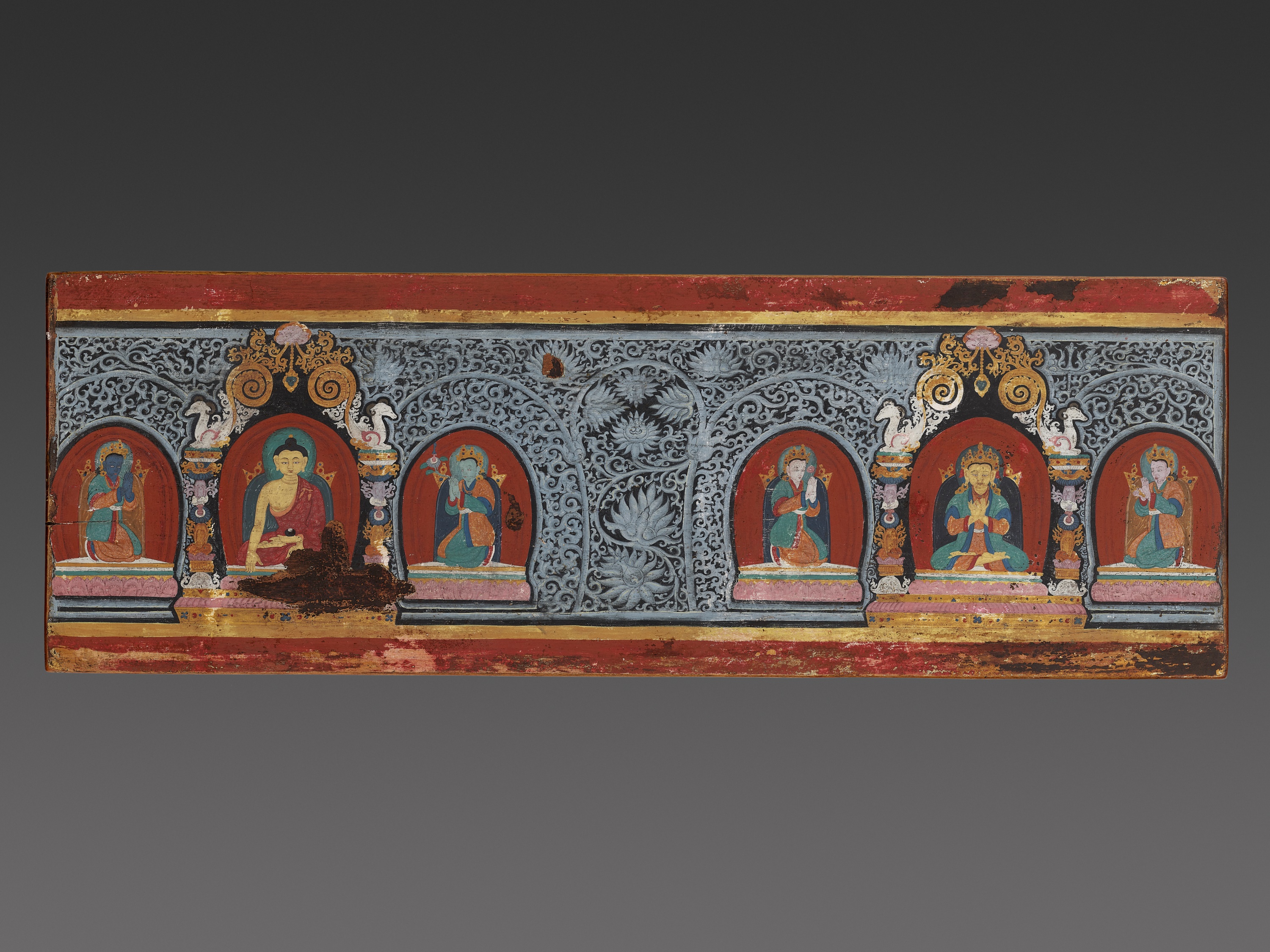 Lot 185 - A RARE AND VERY LARGE PAINTED WOOD SUTRA