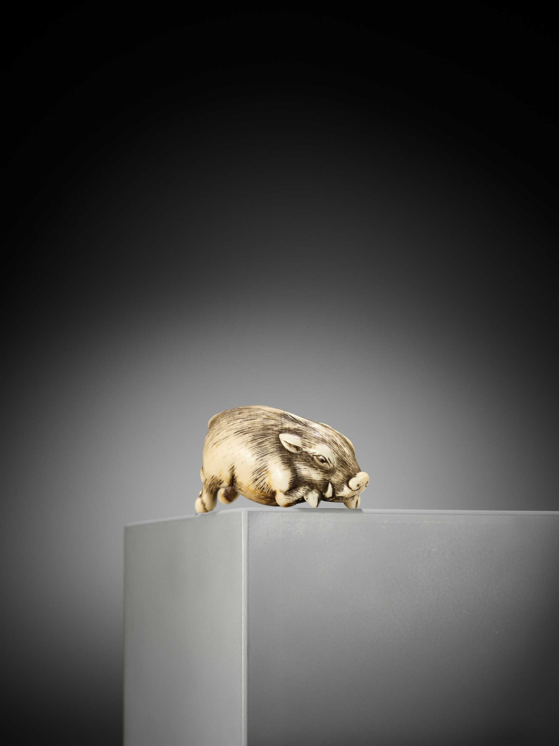 Lot 19 - OKAKOTO: A RARE IVORY NETSUKE OF A RUNNING
