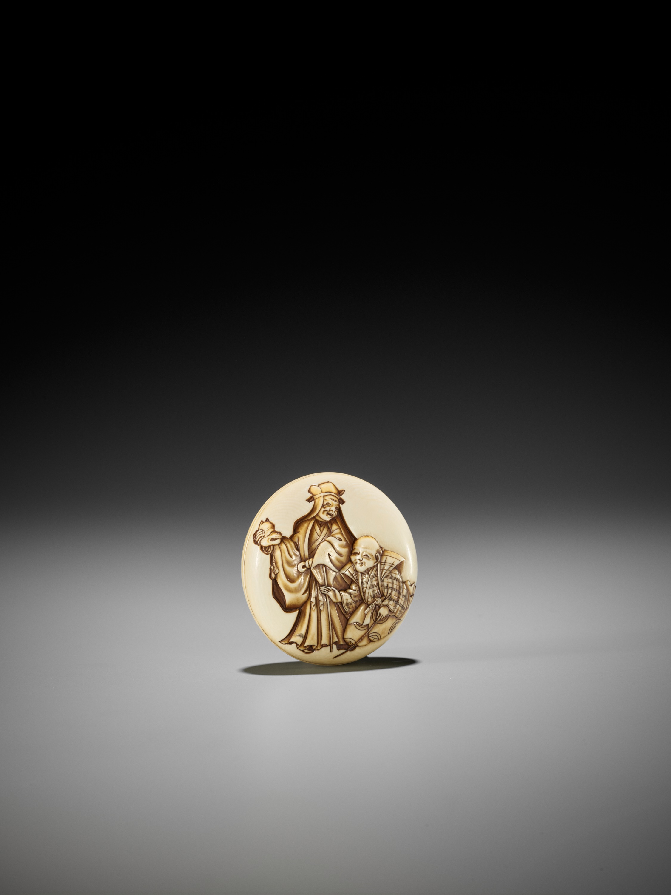 Lot 7 - JUGYOKU: A FINE IVORY MANJU NETSUKE DEPICTING