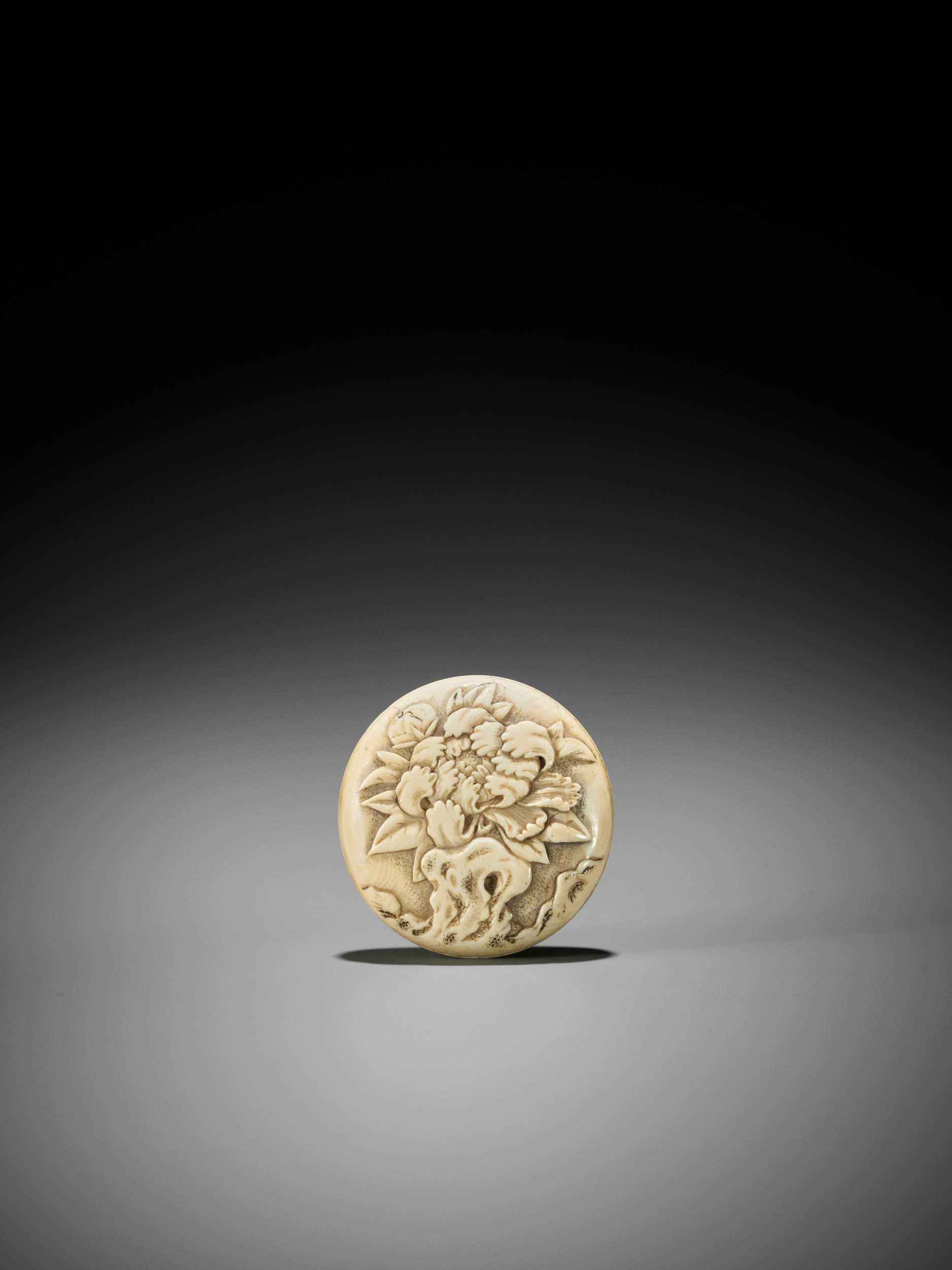 Lot 230 - KOGYOKU: A LARGE IVORY MANJU NETSUKE WITH