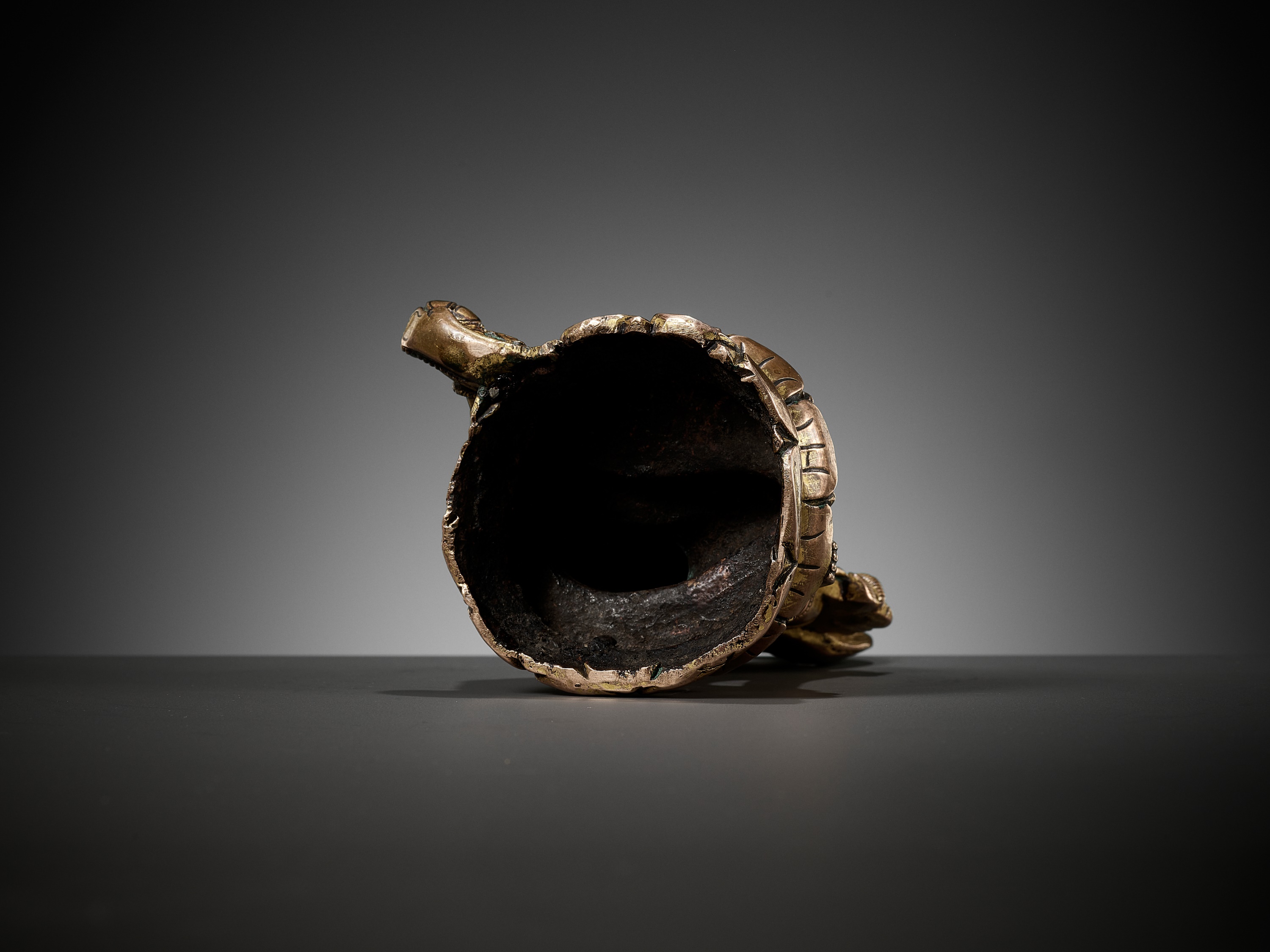 Lot 30 - A GILT COPPER ALLOY FIGURE OF PADMAPANI,