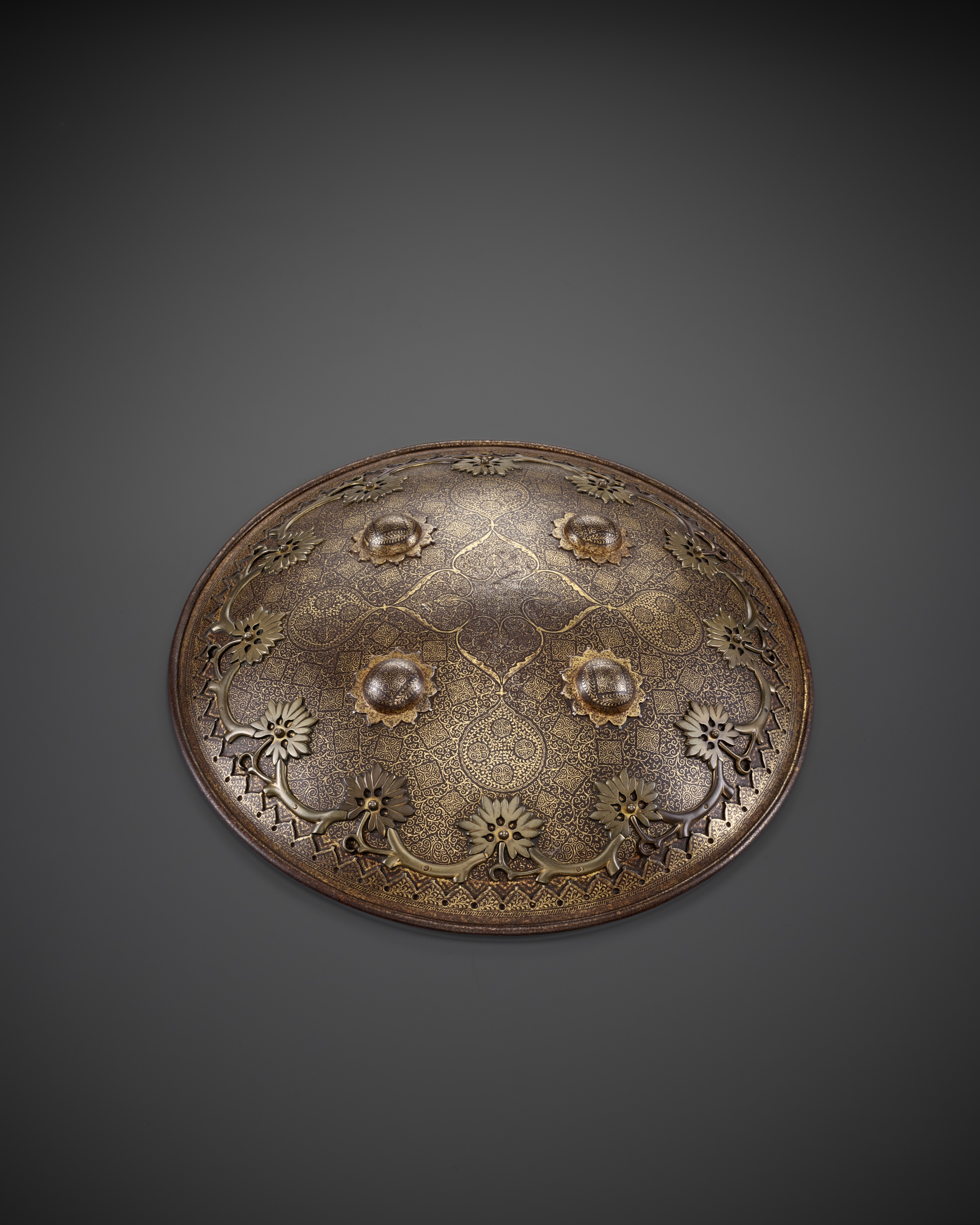 Lot 712 - A MUGHAL STYLE IRON CEREMONIAL SHIELD,