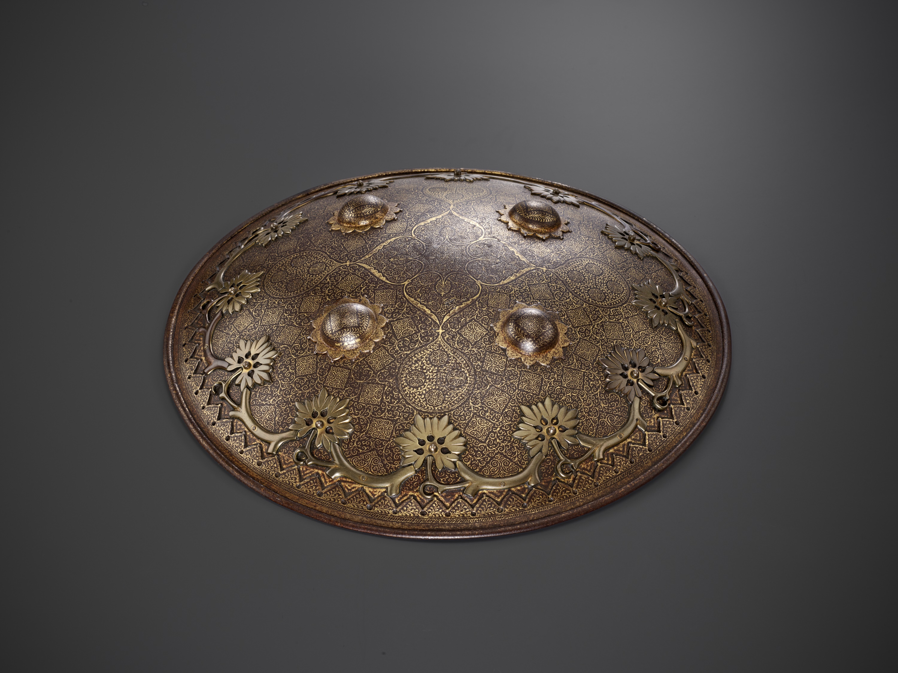 Lot 712 - A MUGHAL STYLE IRON CEREMONIAL SHIELD,