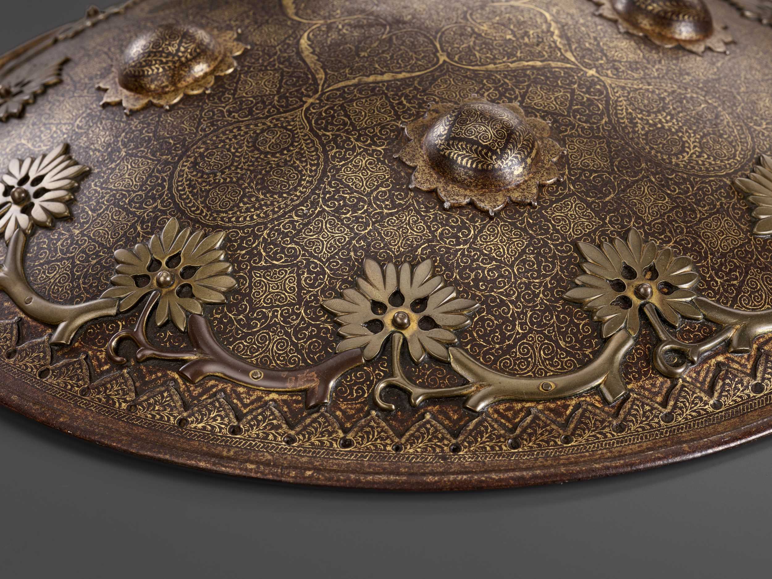 Lot 712 - A MUGHAL STYLE IRON CEREMONIAL SHIELD,