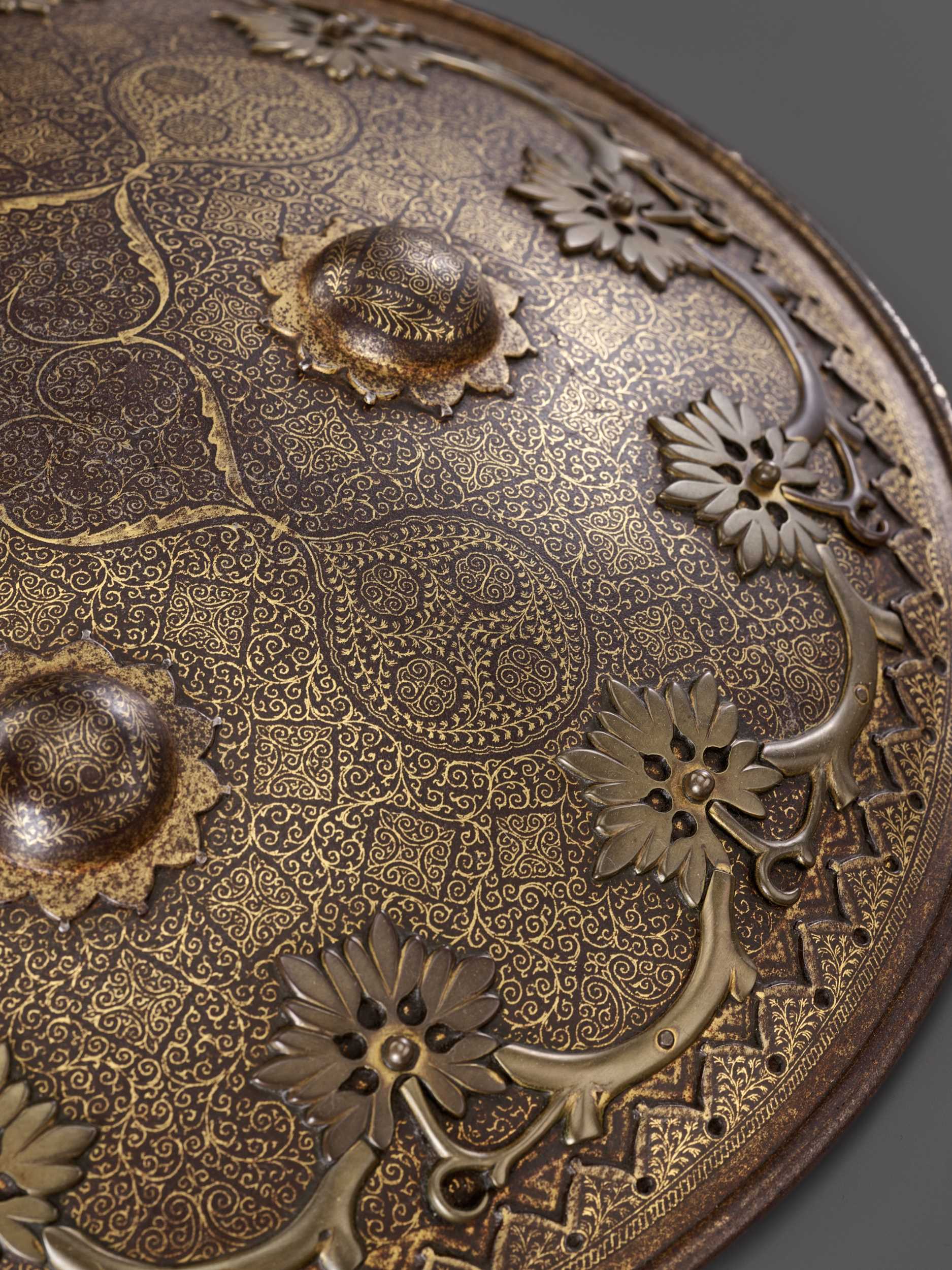 Lot 712 - A MUGHAL STYLE IRON CEREMONIAL SHIELD,