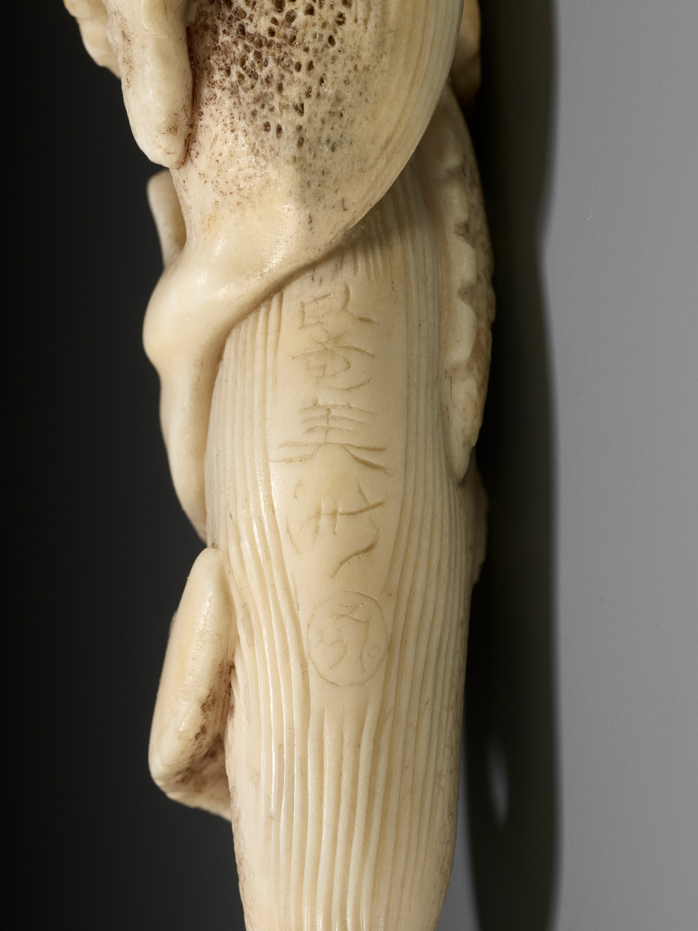 Lot 161 - BISHU: A LARGE BONE NETSUKE OF A WHALE WITH