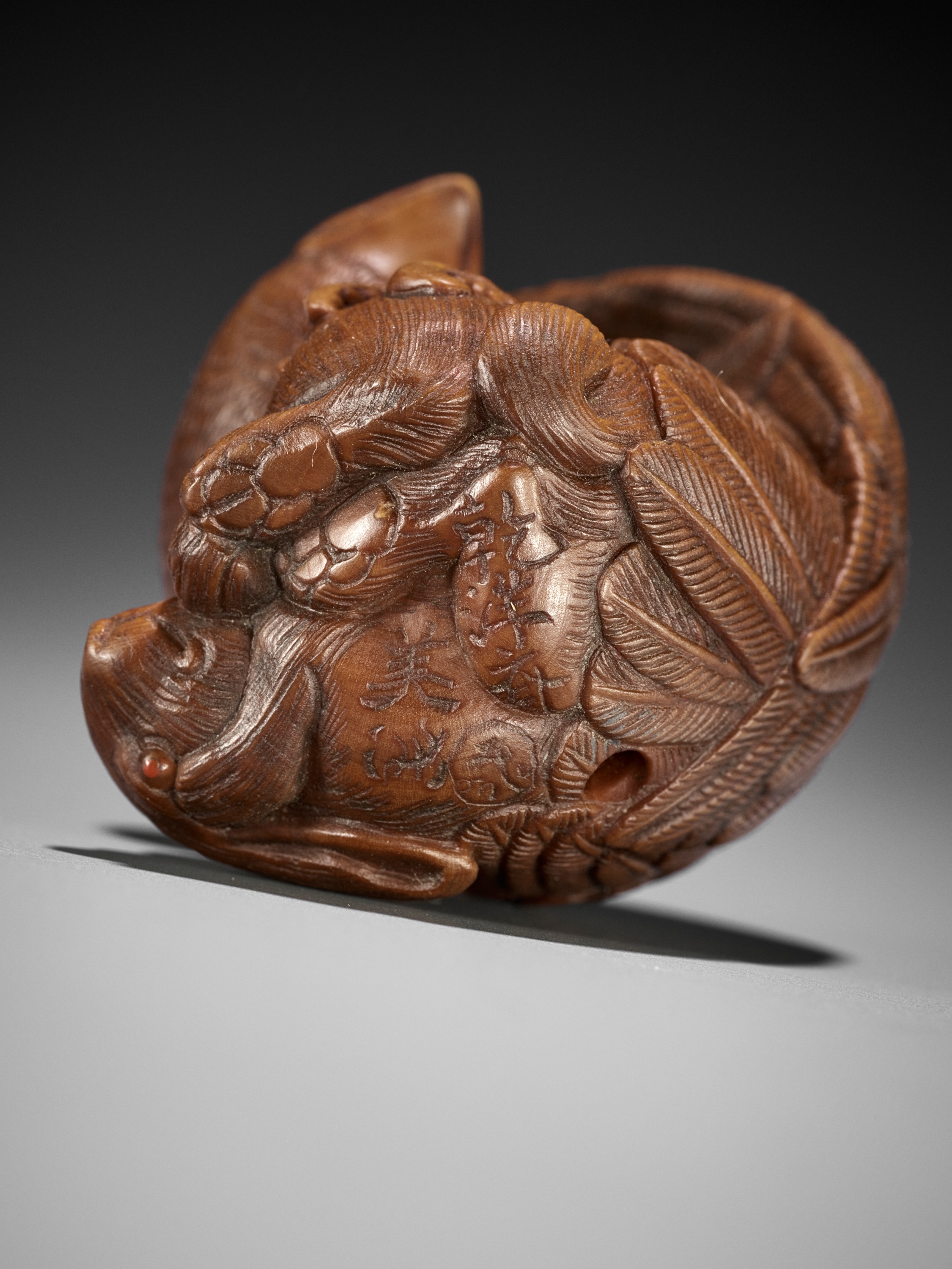 Lot 162 - BISHU: A FINE CONTEMPORARY WOOD NETSUKE OF