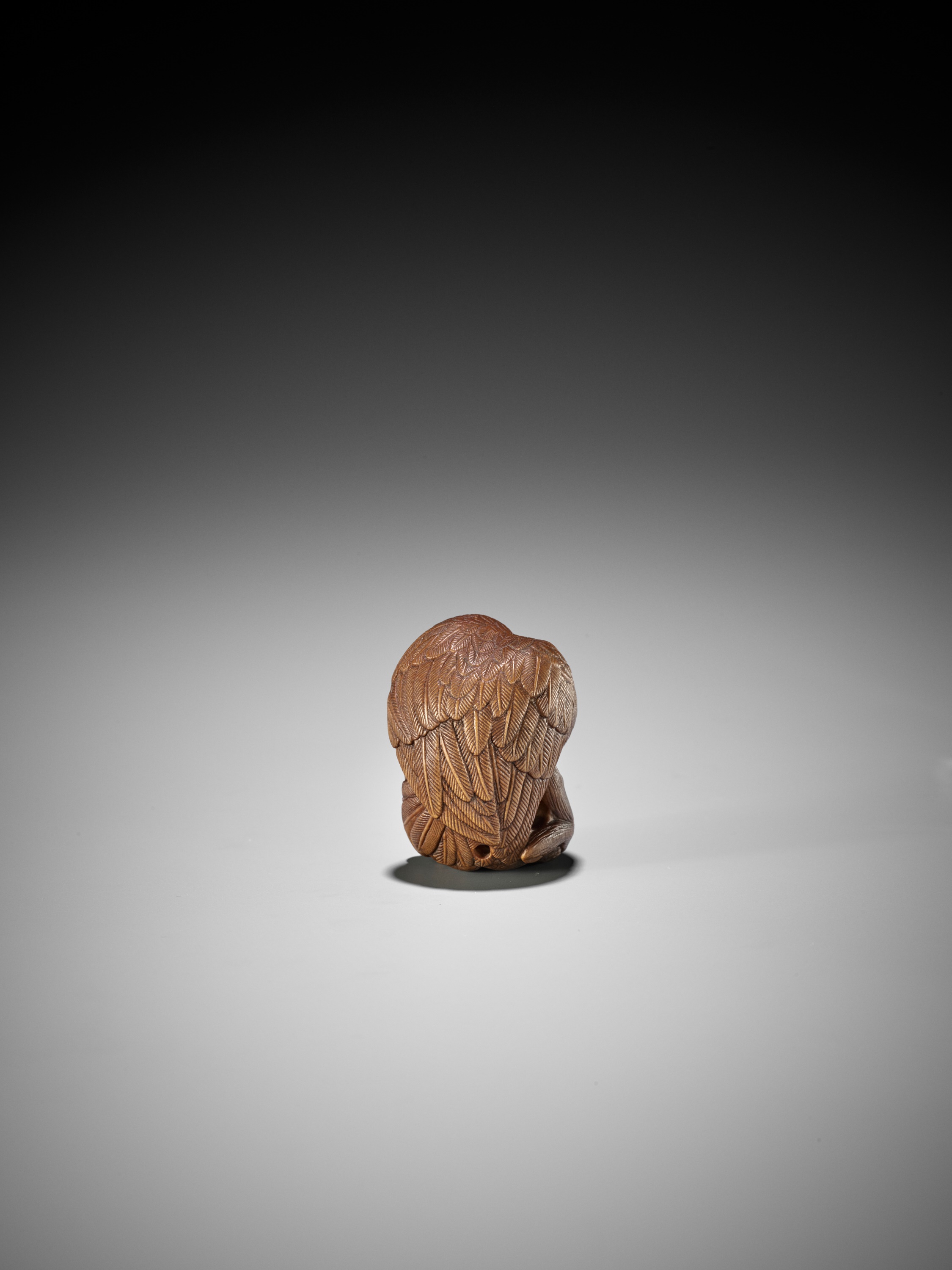 Lot 162 - BISHU: A FINE CONTEMPORARY WOOD NETSUKE OF