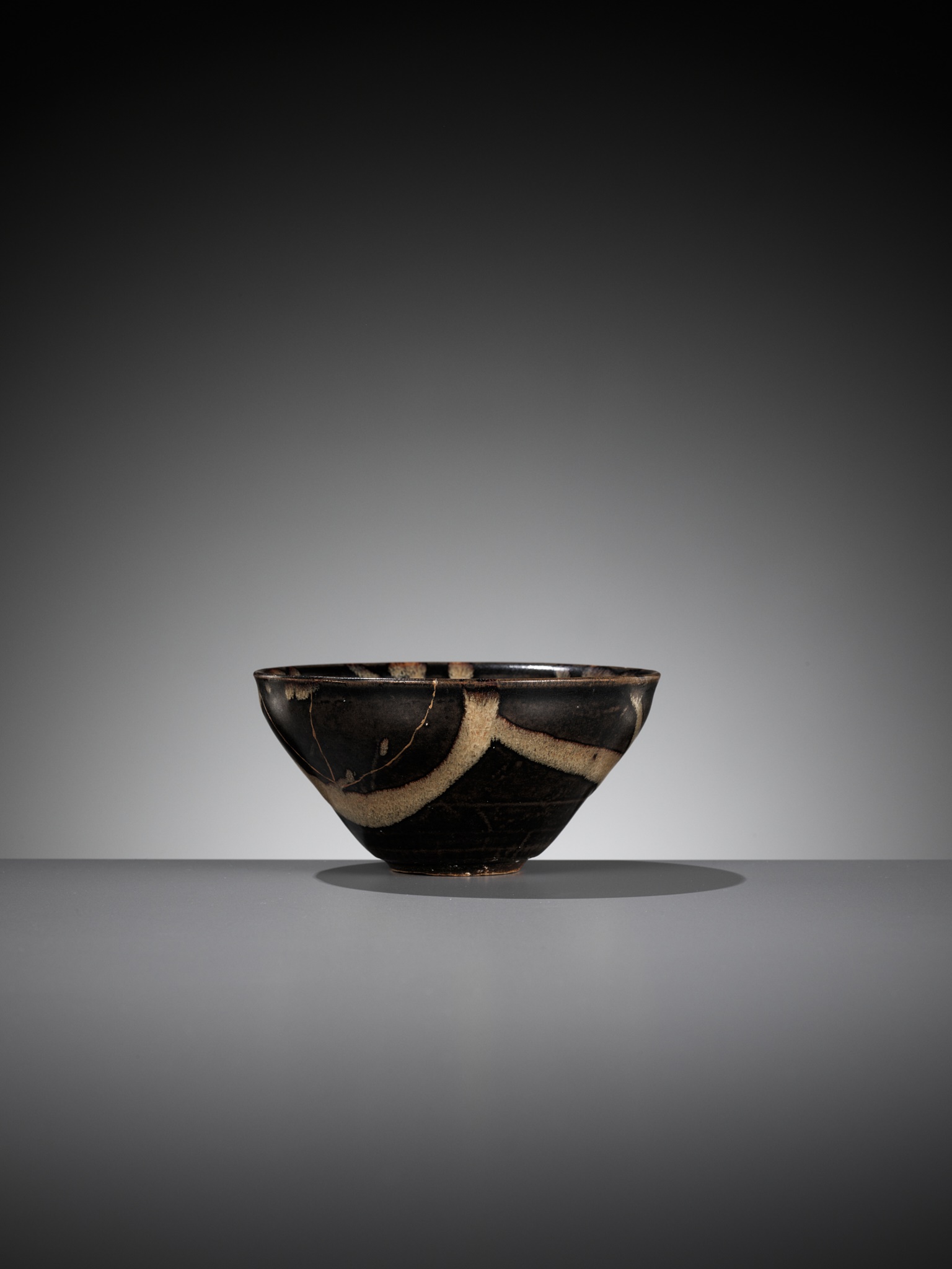 Lot 75 - A JIZHOU PHOSPHATIC-SPLASHED BLACK-GLAZED