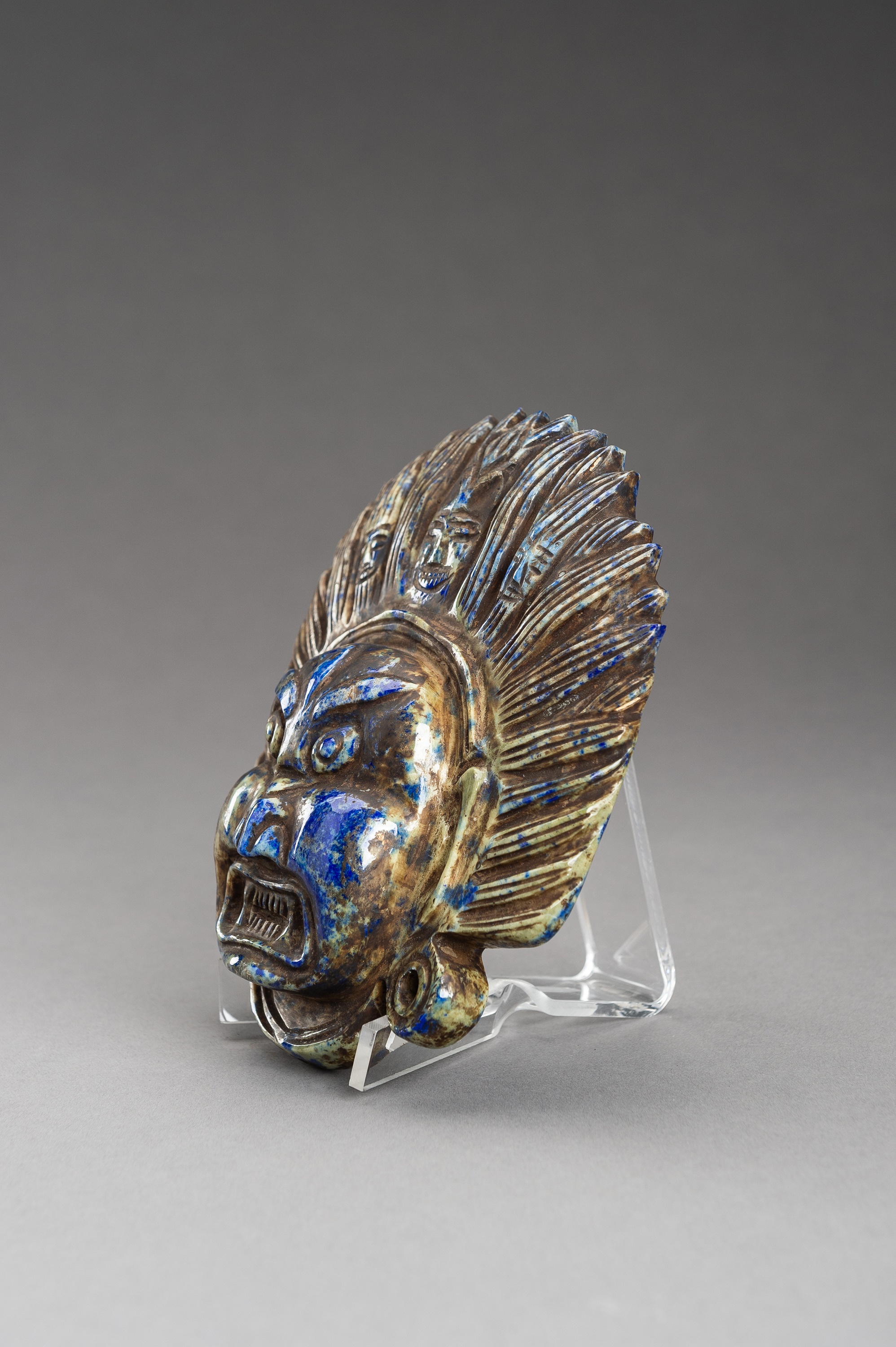 Lot 90 - A LAPIS LAZULI MASK OF A WRATHFUL DEITY
