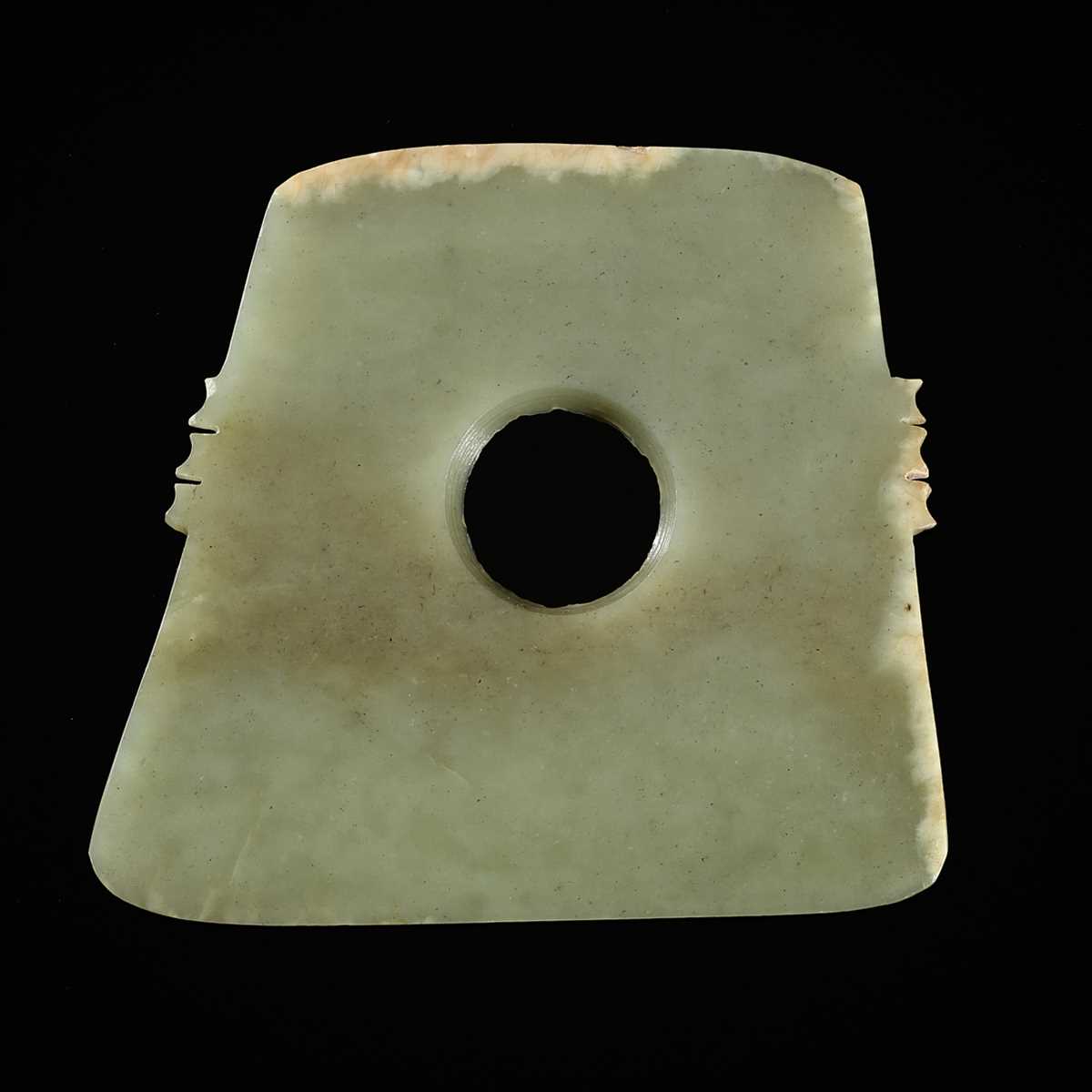 Lot 796 - A CELADON JADE NOTCHED YUE AXE, QIJIA