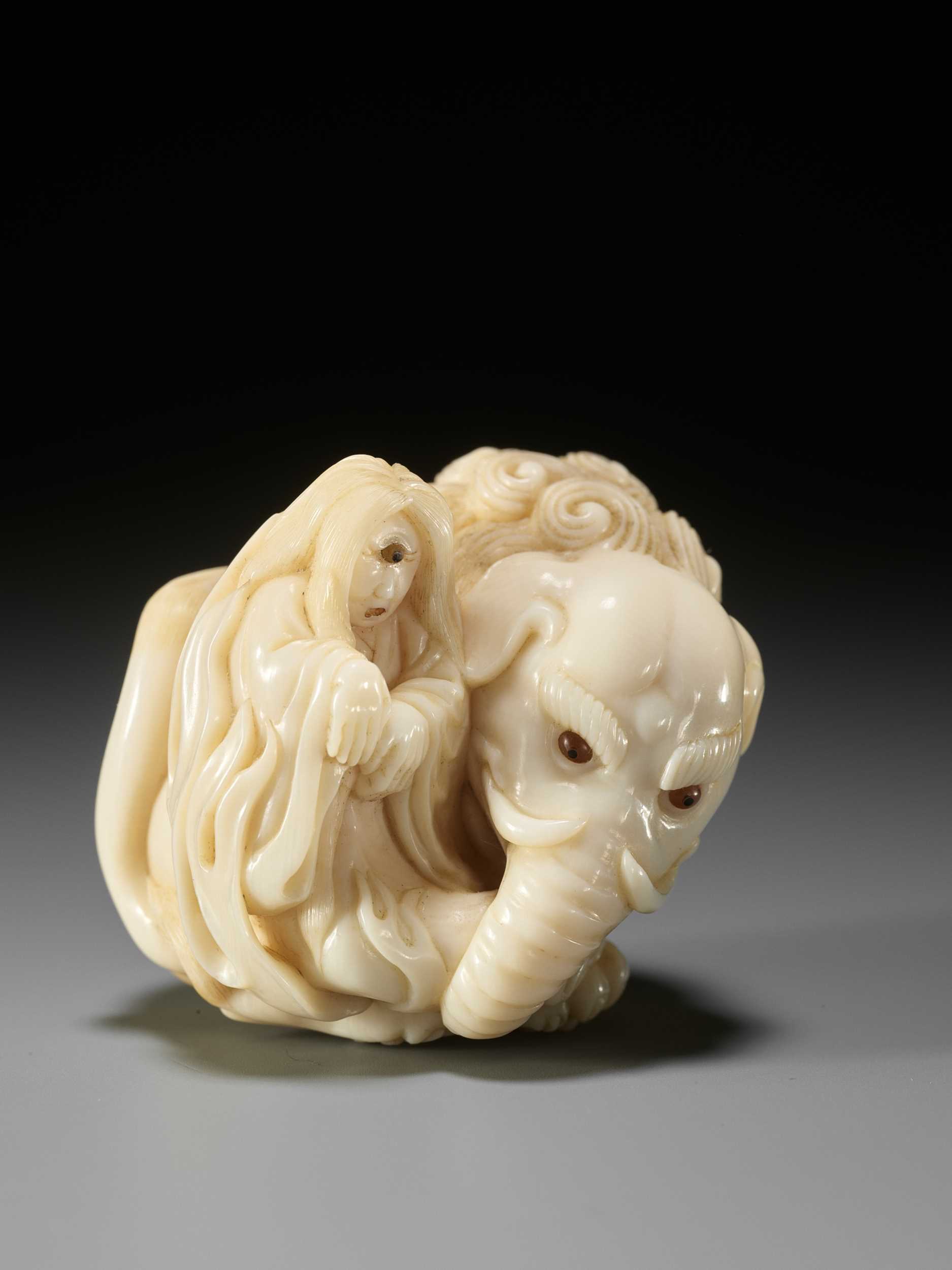 Lot 166 - KENJI: A RARE MARINE TUSK NETSUKE OF A BAKU