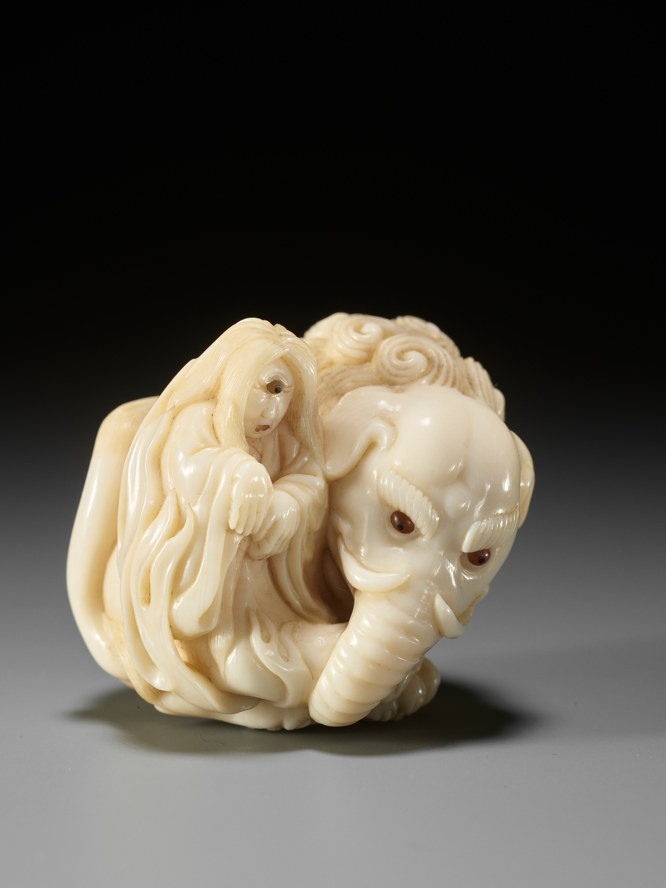Lot 166 - KENJI: A RARE MARINE TUSK NETSUKE OF A BAKU