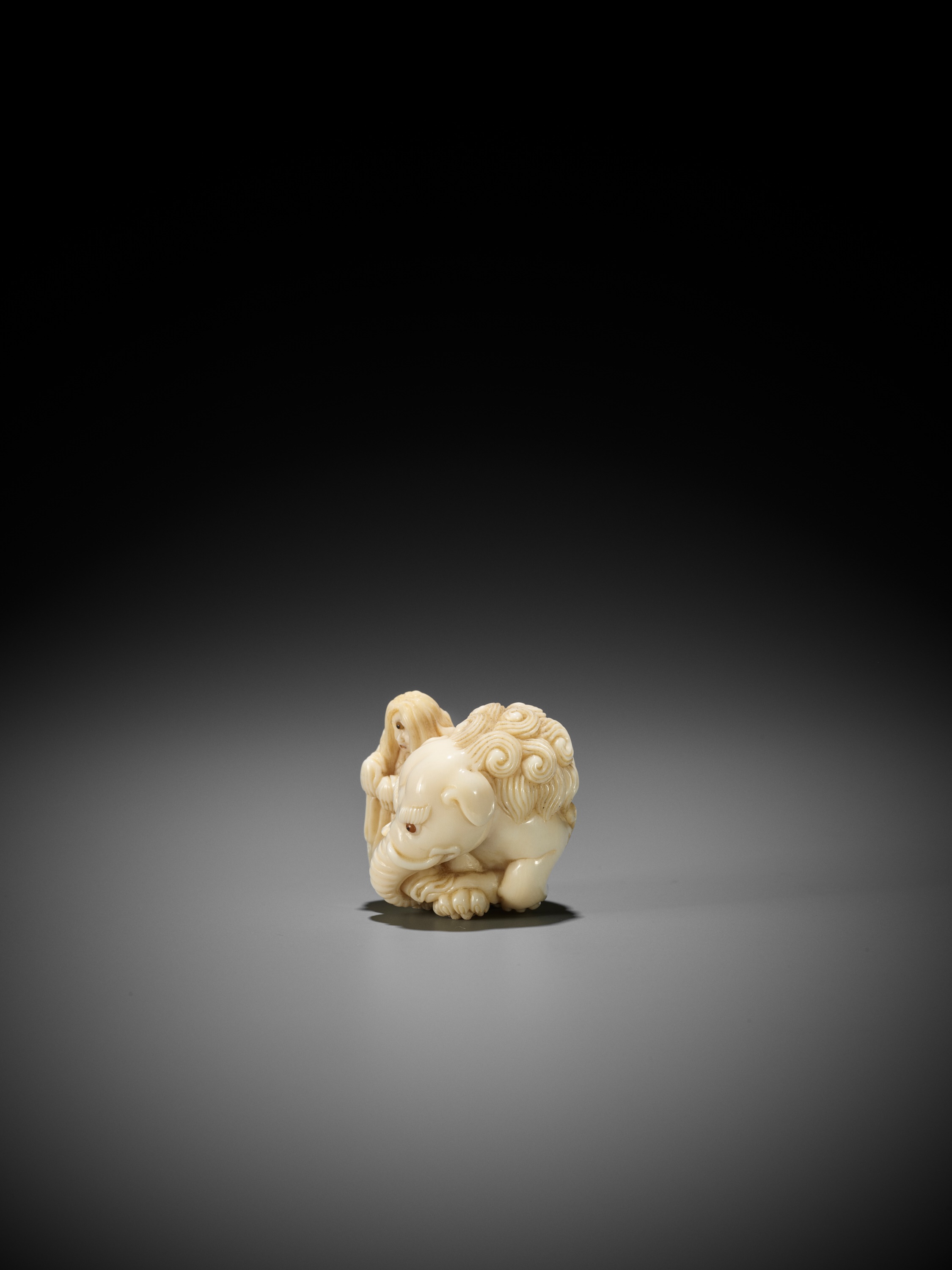 Lot 166 - KENJI: A RARE MARINE TUSK NETSUKE OF A BAKU