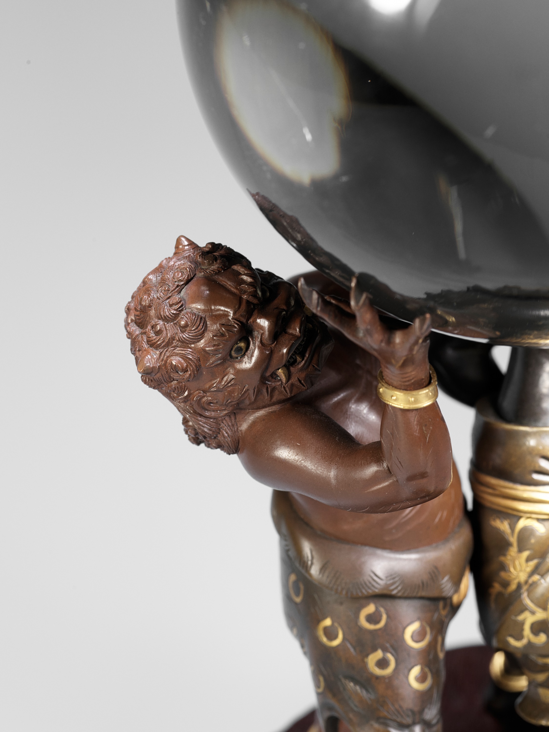 Lot 56 - AN IMPRESSIVE BRONZE OF TWO ONI HOLDING A