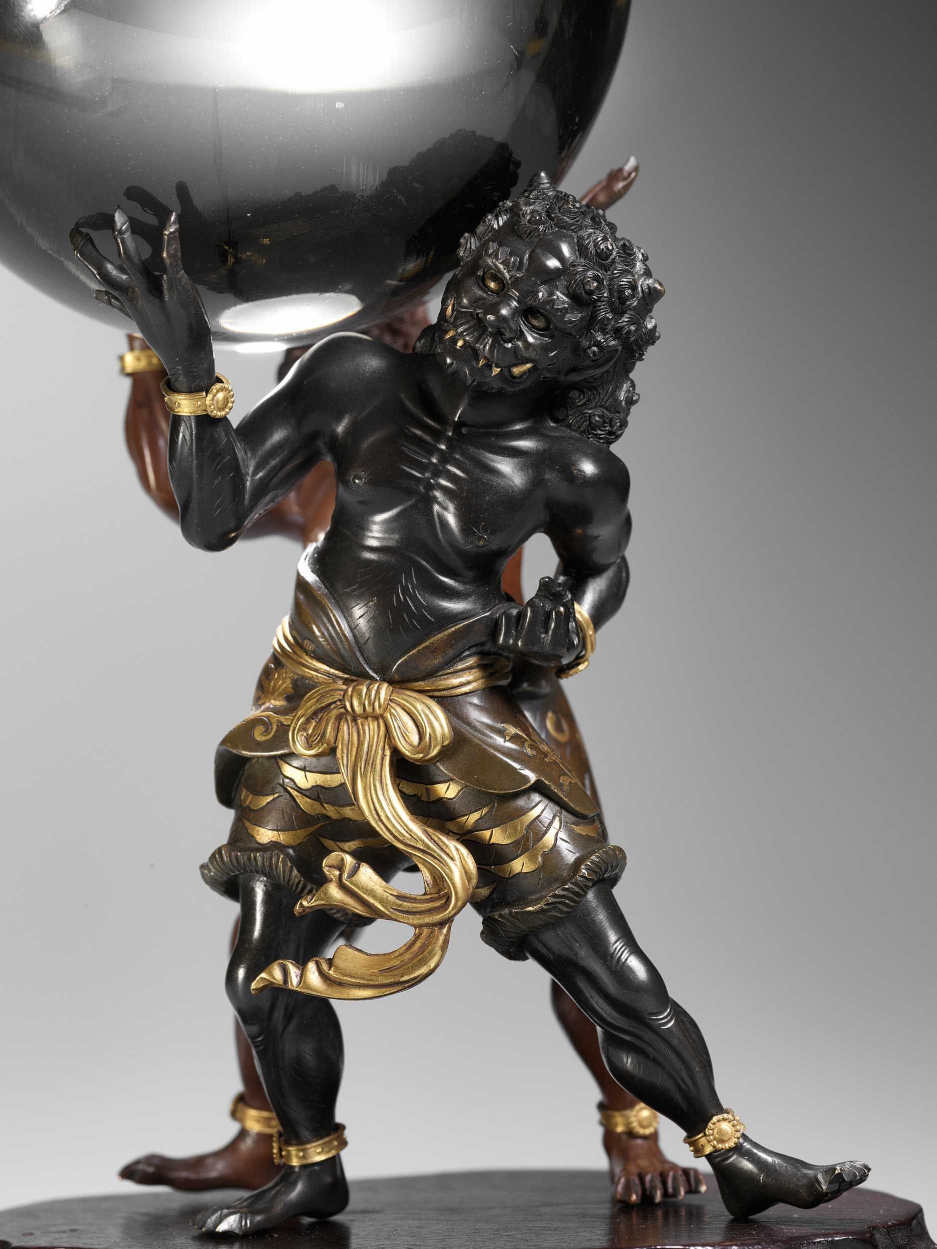 Lot 56 - AN IMPRESSIVE BRONZE OF TWO ONI HOLDING A