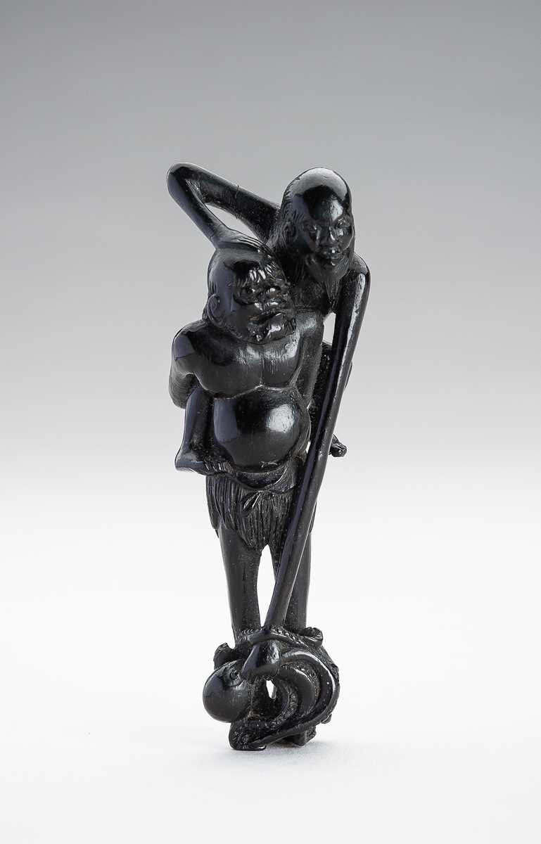 Lot 1520 - A TALL EBONY WOOD NETSUKE OF ASHINAGA AND