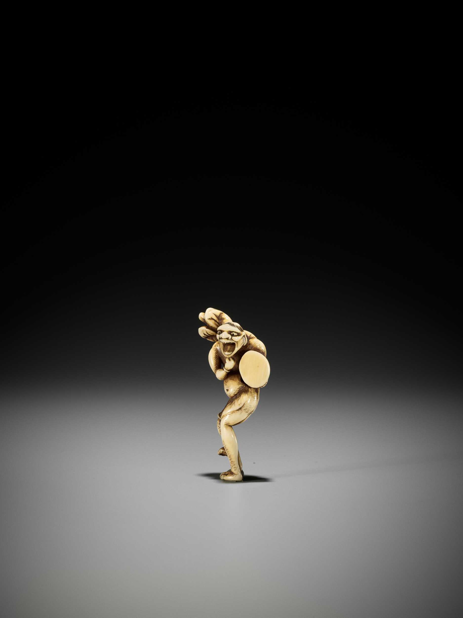 Lot 66 - OTOMAN: A SUPERB IVORY NETSUKE OF AN ONI WITH