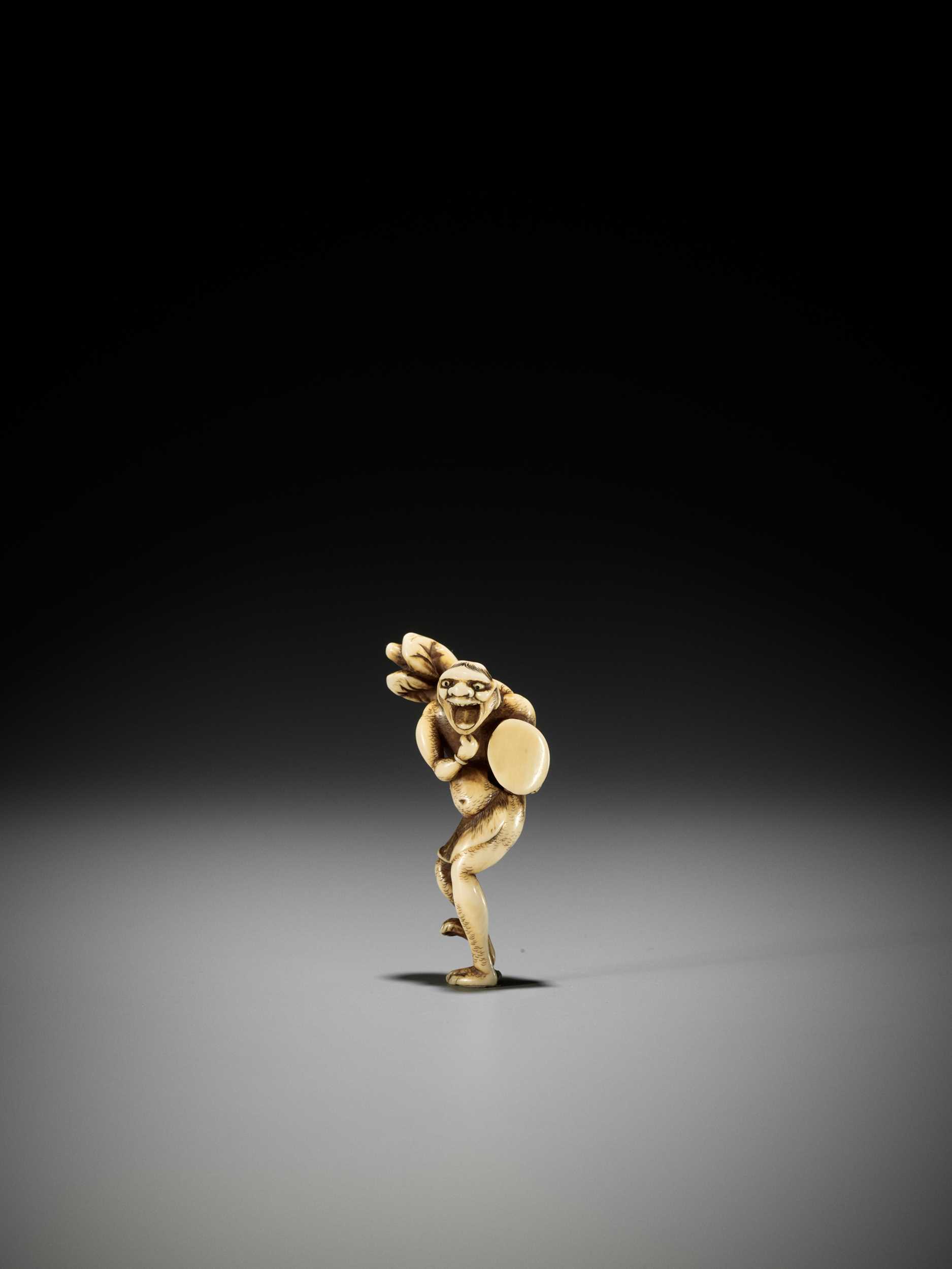 Lot 66 - OTOMAN: A SUPERB IVORY NETSUKE OF AN ONI WITH