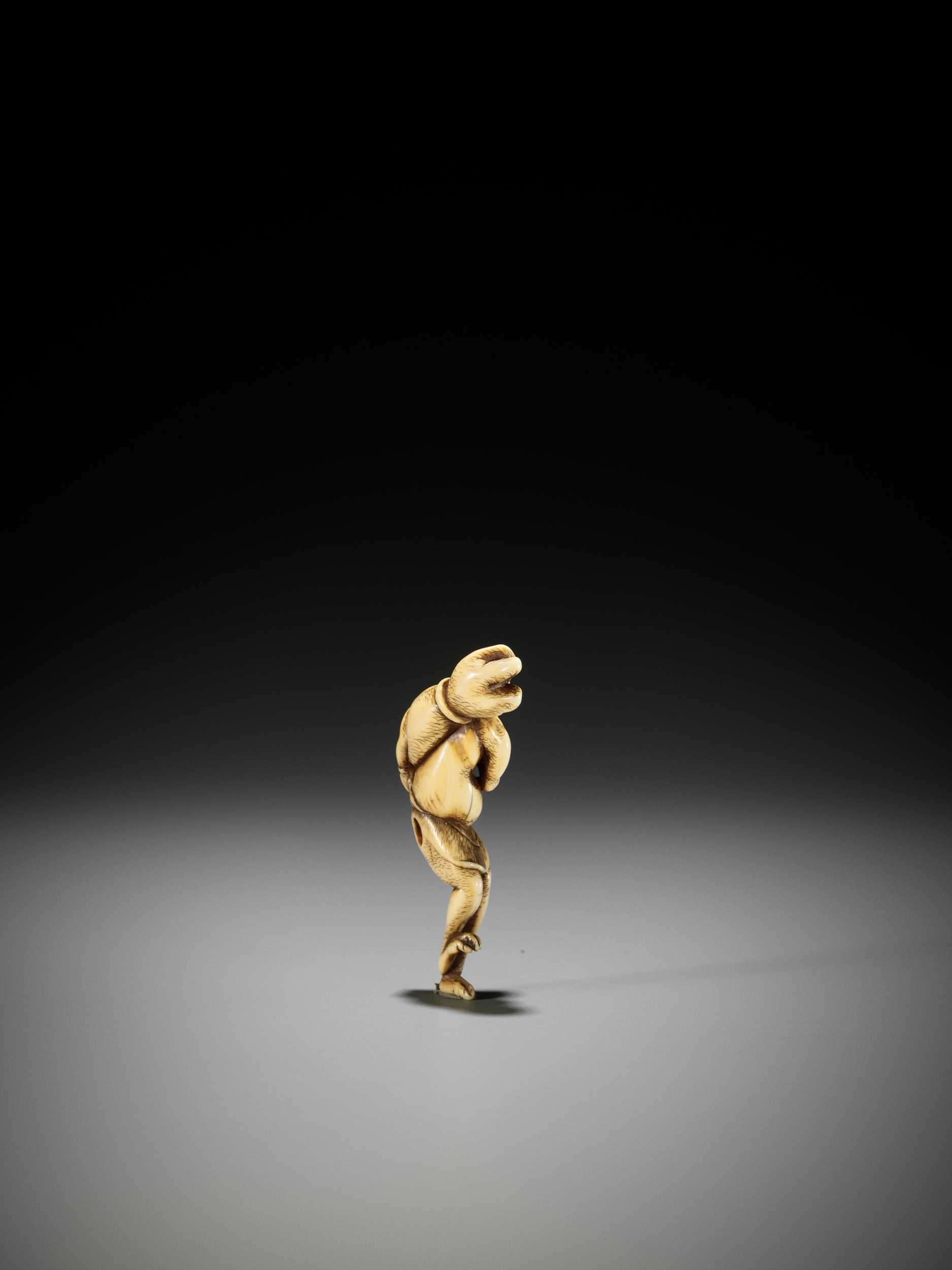 Lot 66 - OTOMAN: A SUPERB IVORY NETSUKE OF AN ONI WITH