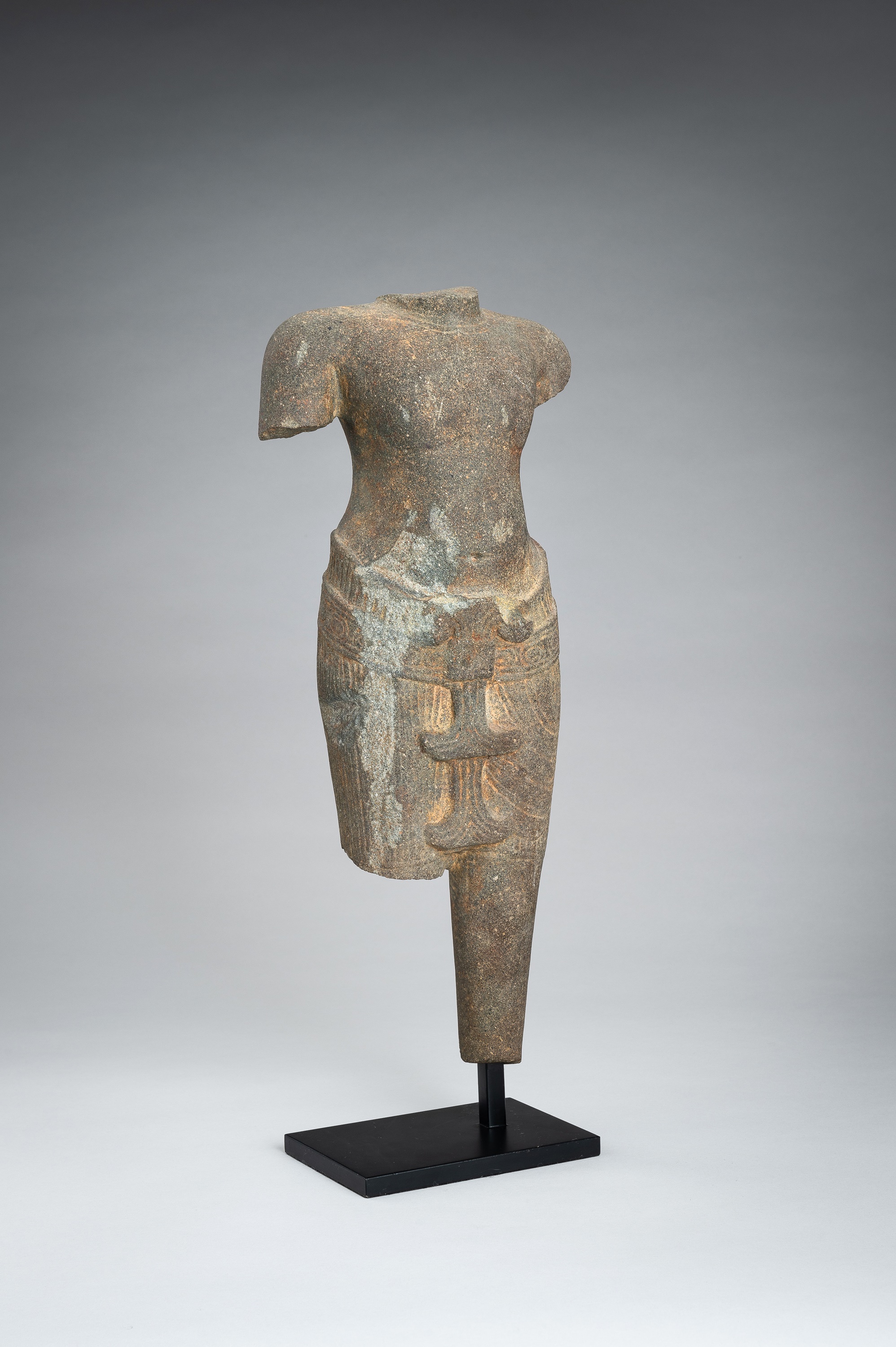 Lot 806 - A KHMER ANGKOR WAT STYLE SANDSTONE TORSO OF