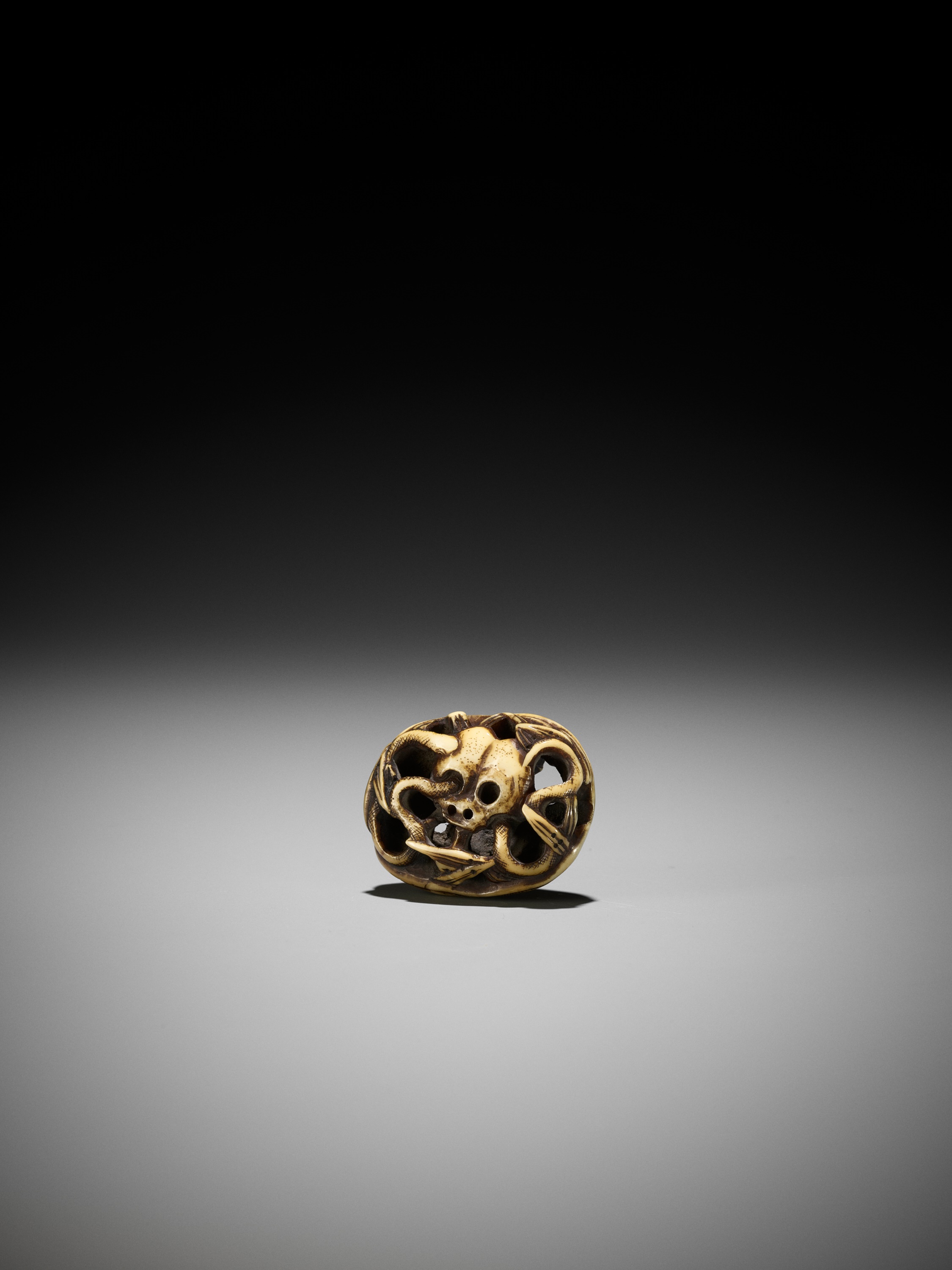 Lot 267 - A RARE WALRUS TUSK RYUSA MANJU NETSUKE OF A