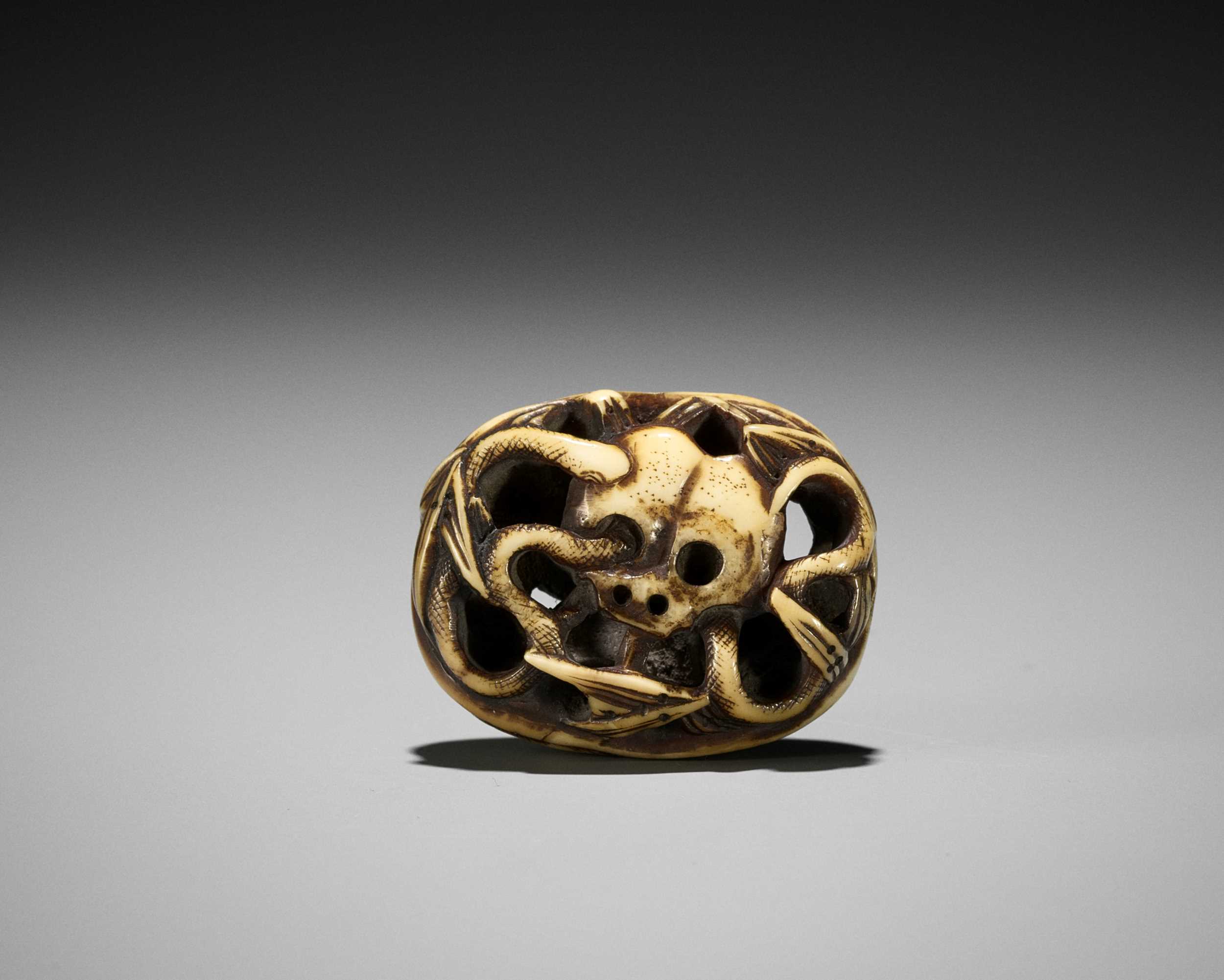 Lot 267 - A RARE WALRUS TUSK RYUSA MANJU NETSUKE OF A