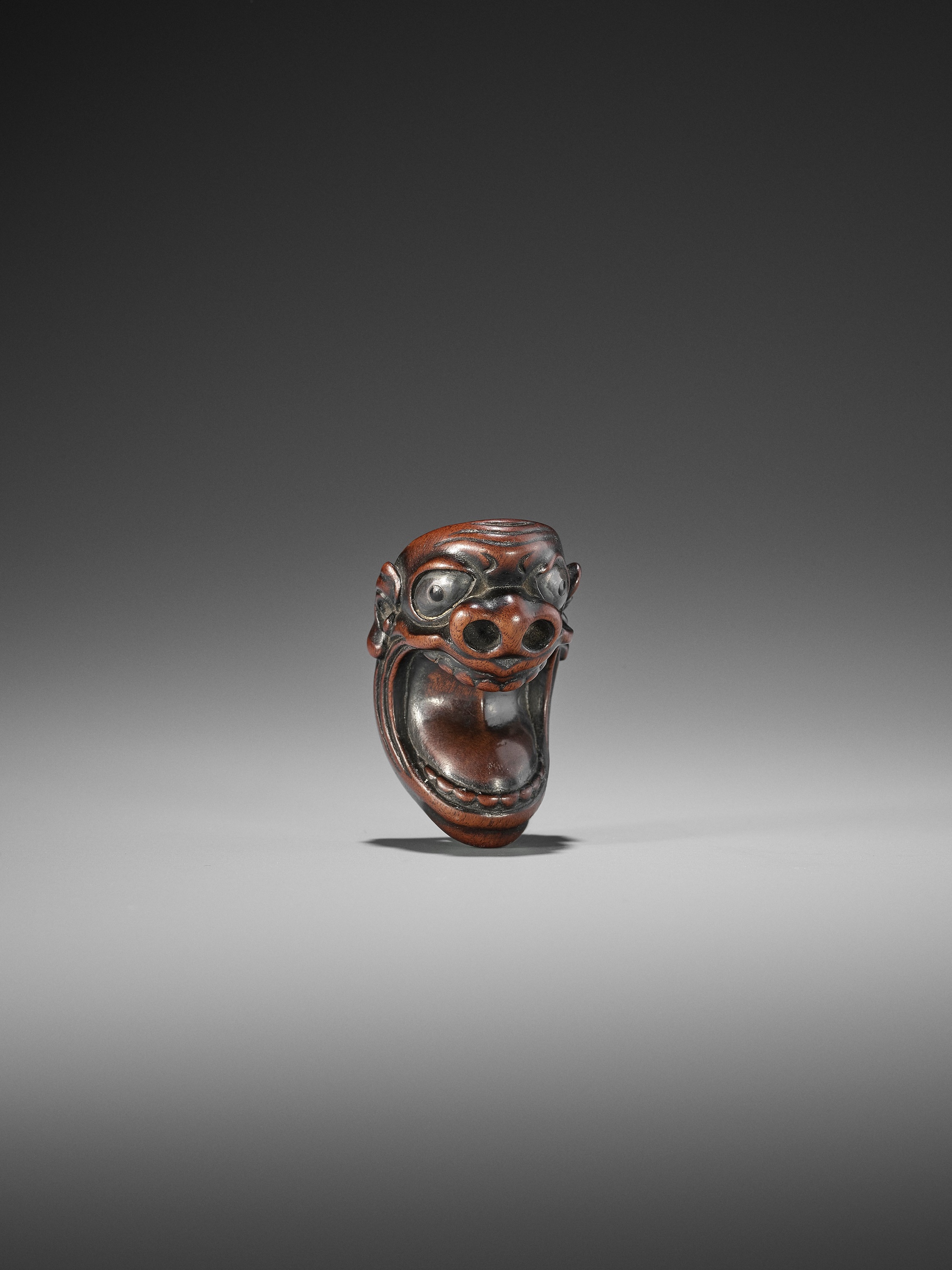 Lot 90 - HOGEN: A RARE WOOD MASK NETSUKE