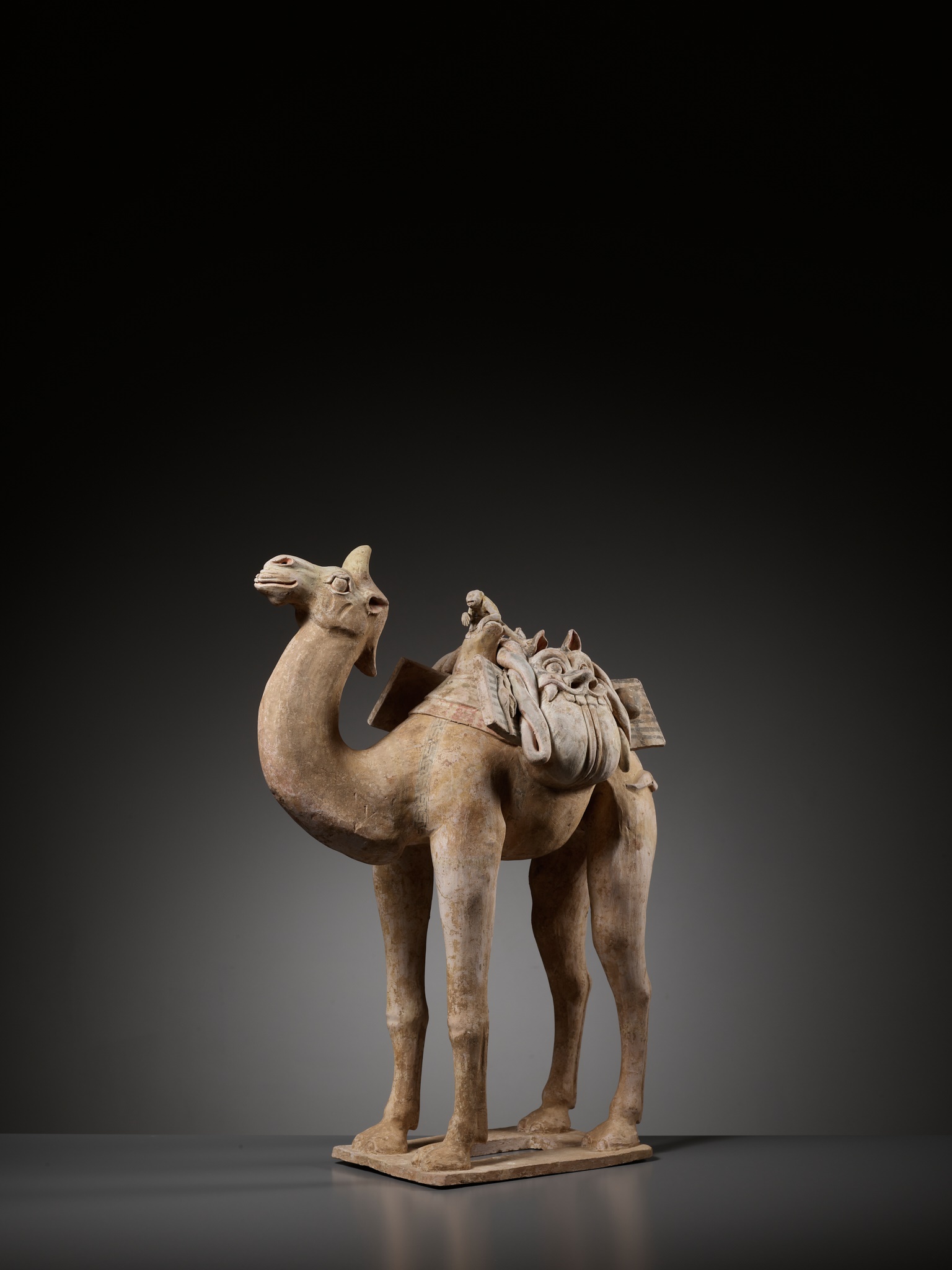 Lot 70 - A RARE AND LARGE POTTERY GROUP OF A MONKEY