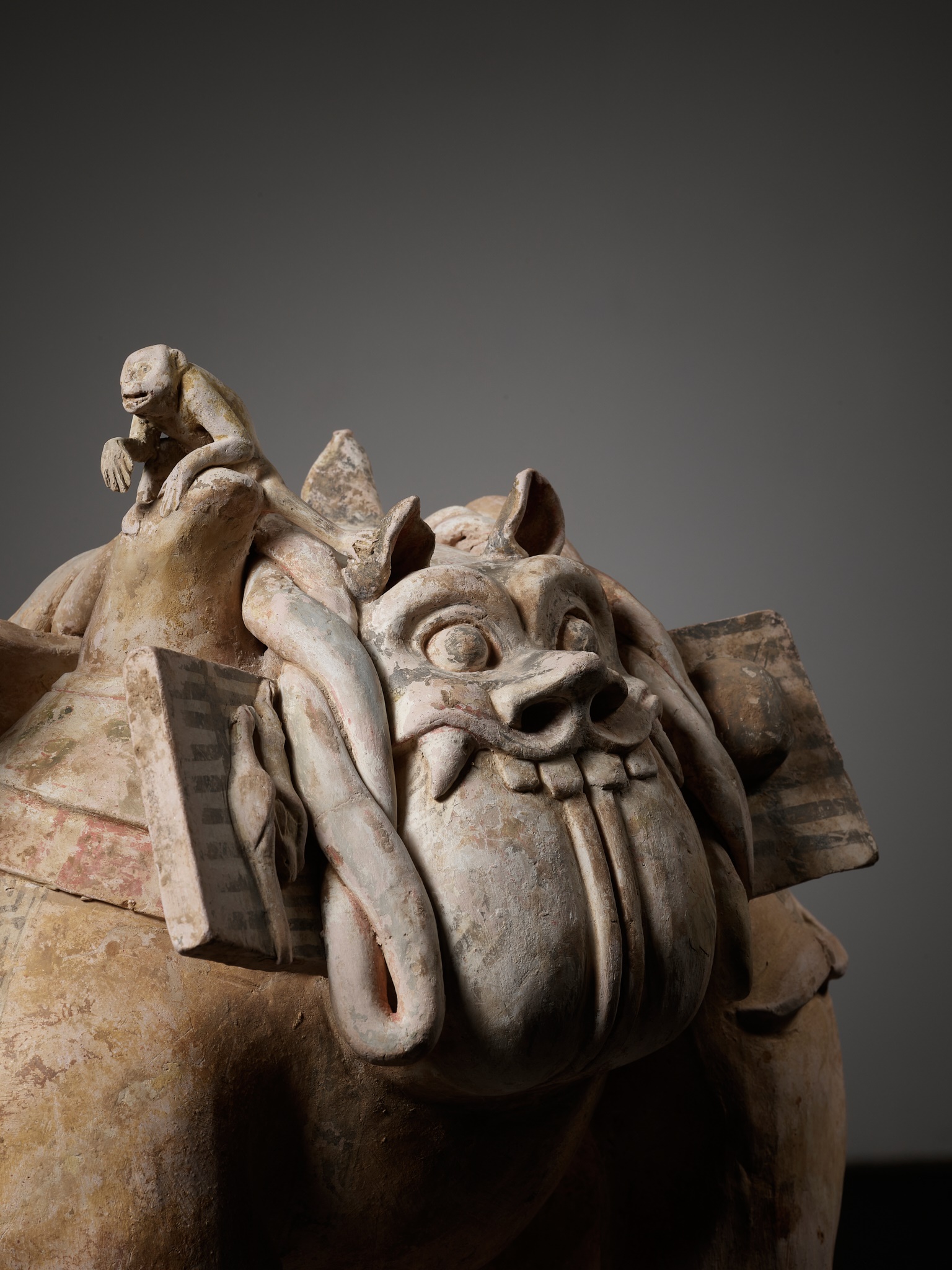 Lot 70 - A RARE AND LARGE POTTERY GROUP OF A MONKEY