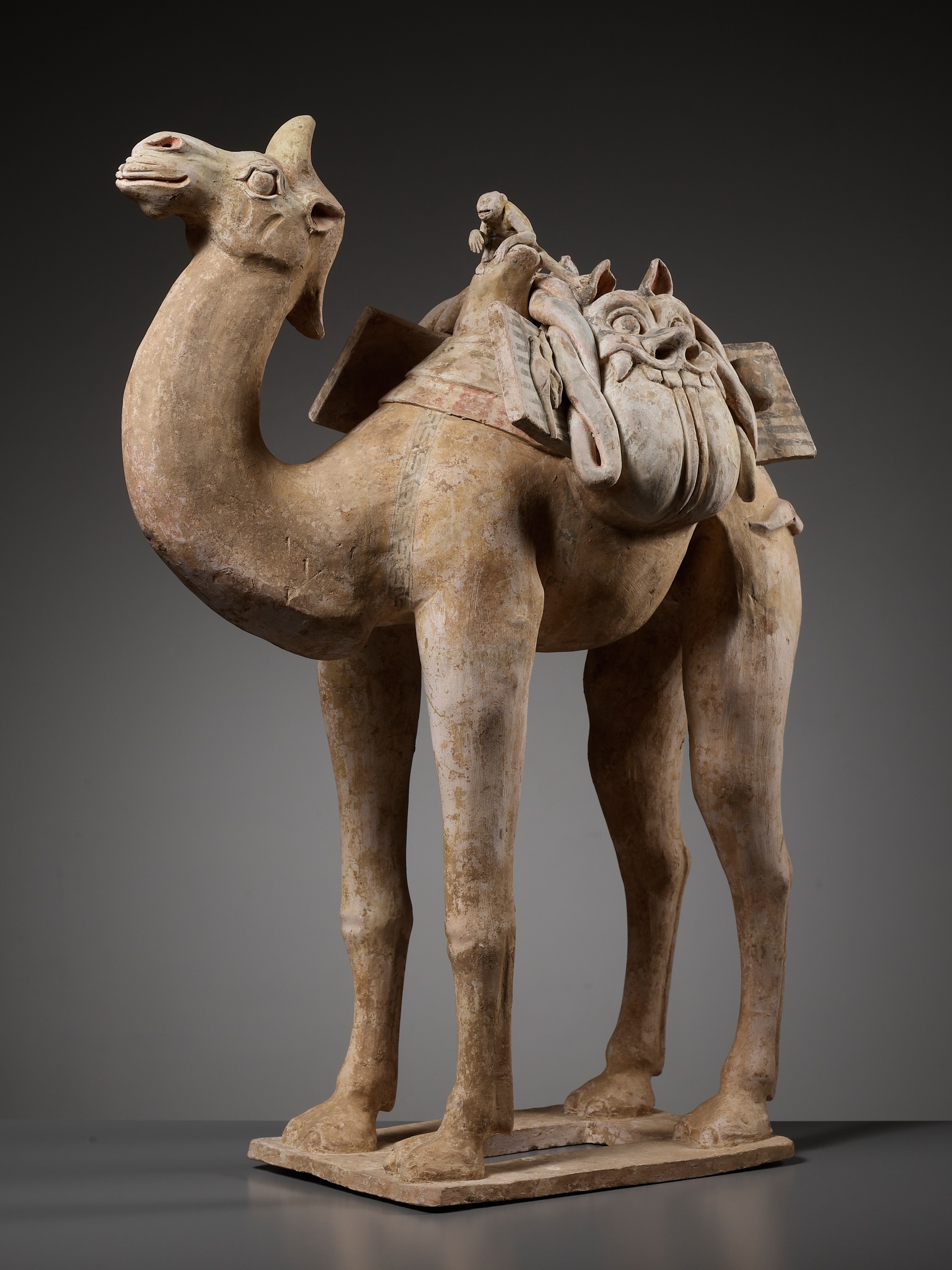 Lot 70 - A RARE AND LARGE POTTERY GROUP OF A MONKEY