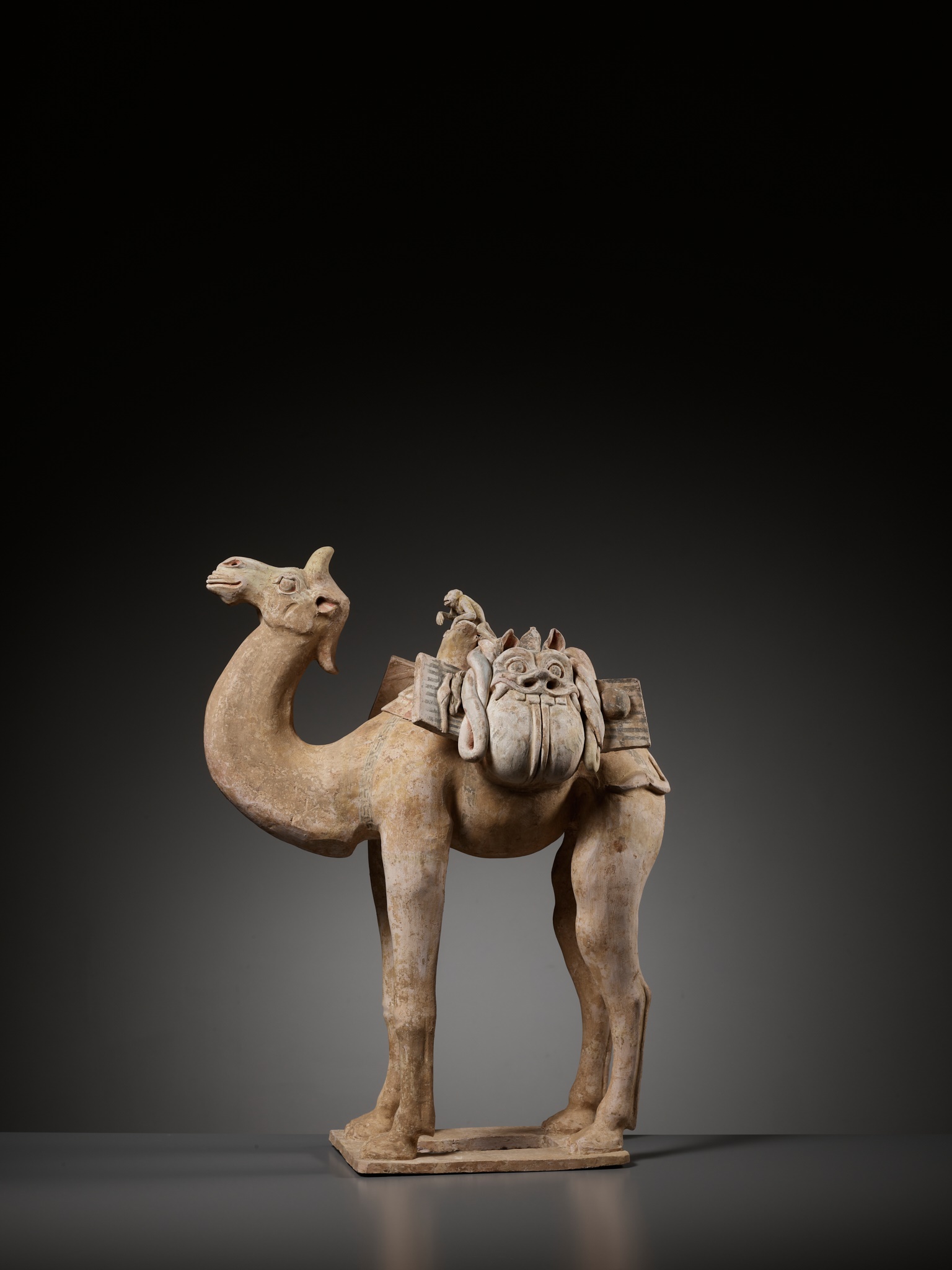 Lot 70 - A RARE AND LARGE POTTERY GROUP OF A MONKEY