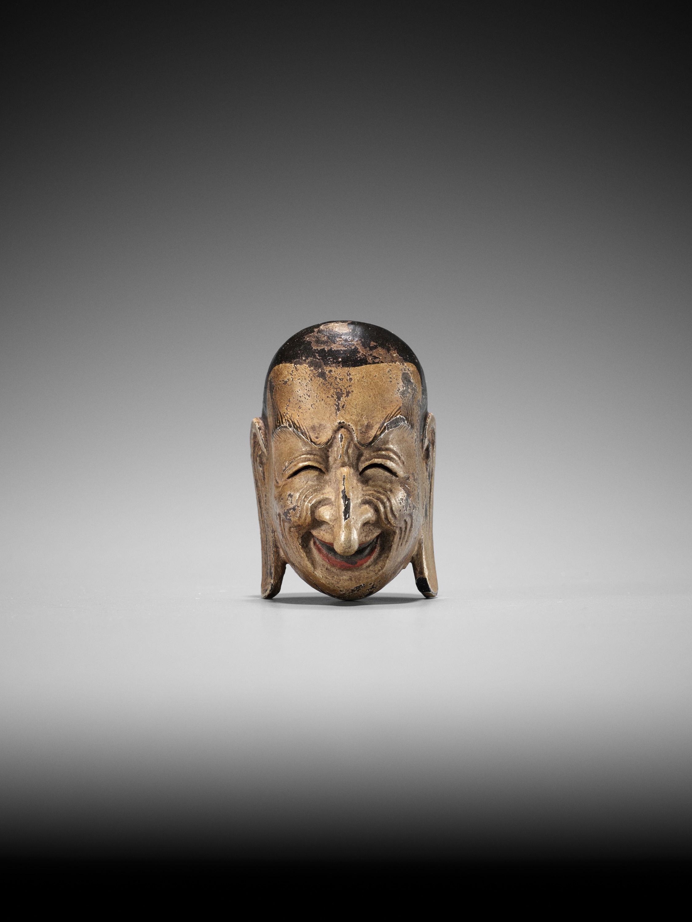 Lot 255 - TETSURO: A LACQUERED WOOD GIGAKU MASK